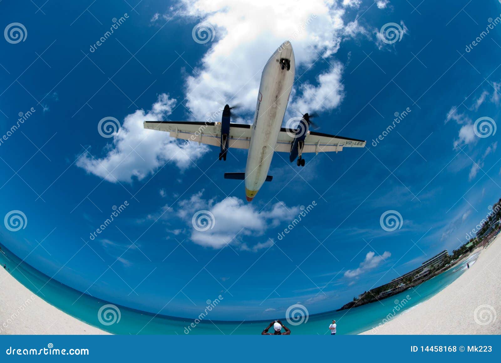 Aircraft flying over beach stock photo. Image of angle - 14458168