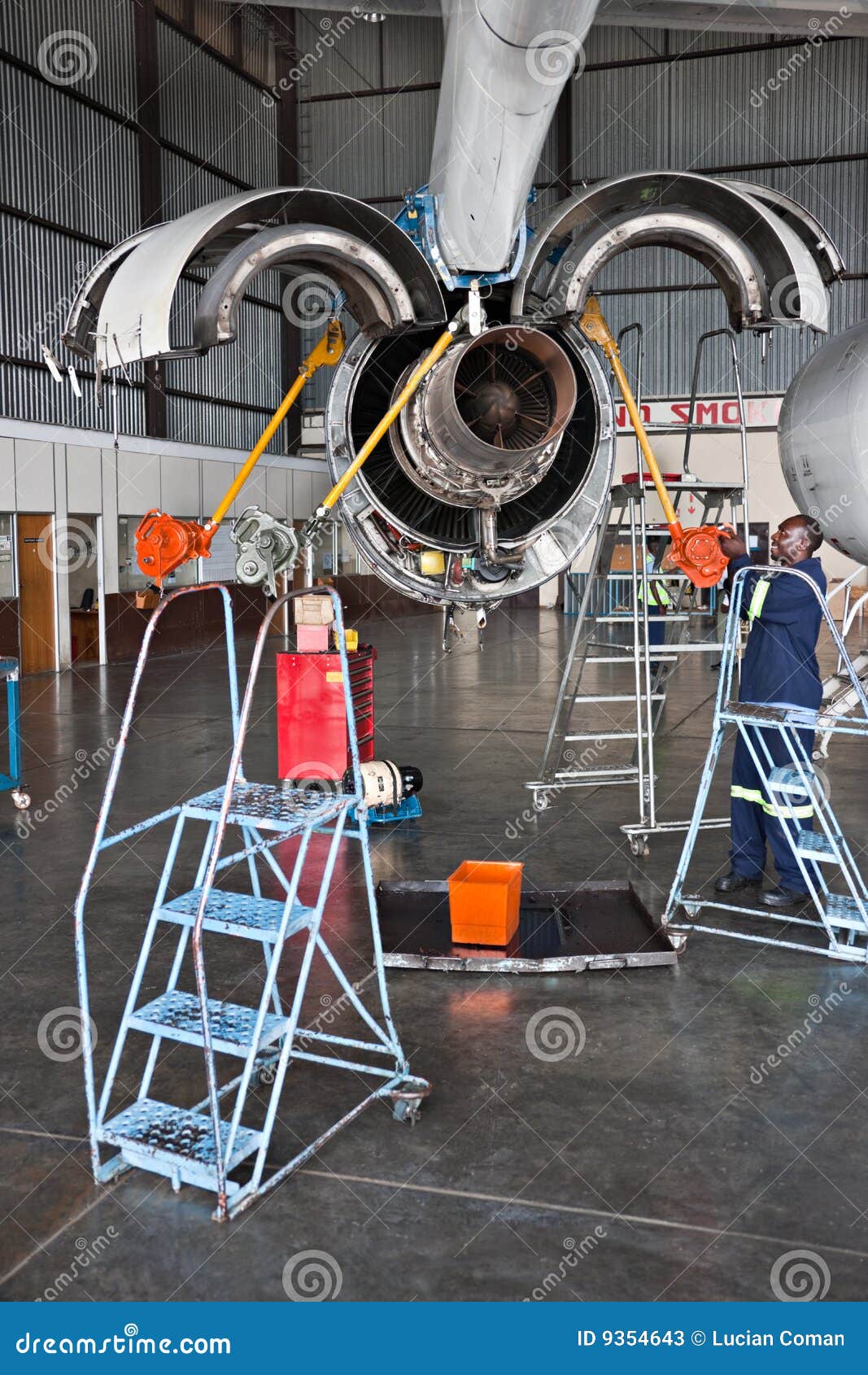 Aircraft Maintenance Mechanics Inspecting And Working On Airplane Jet ...