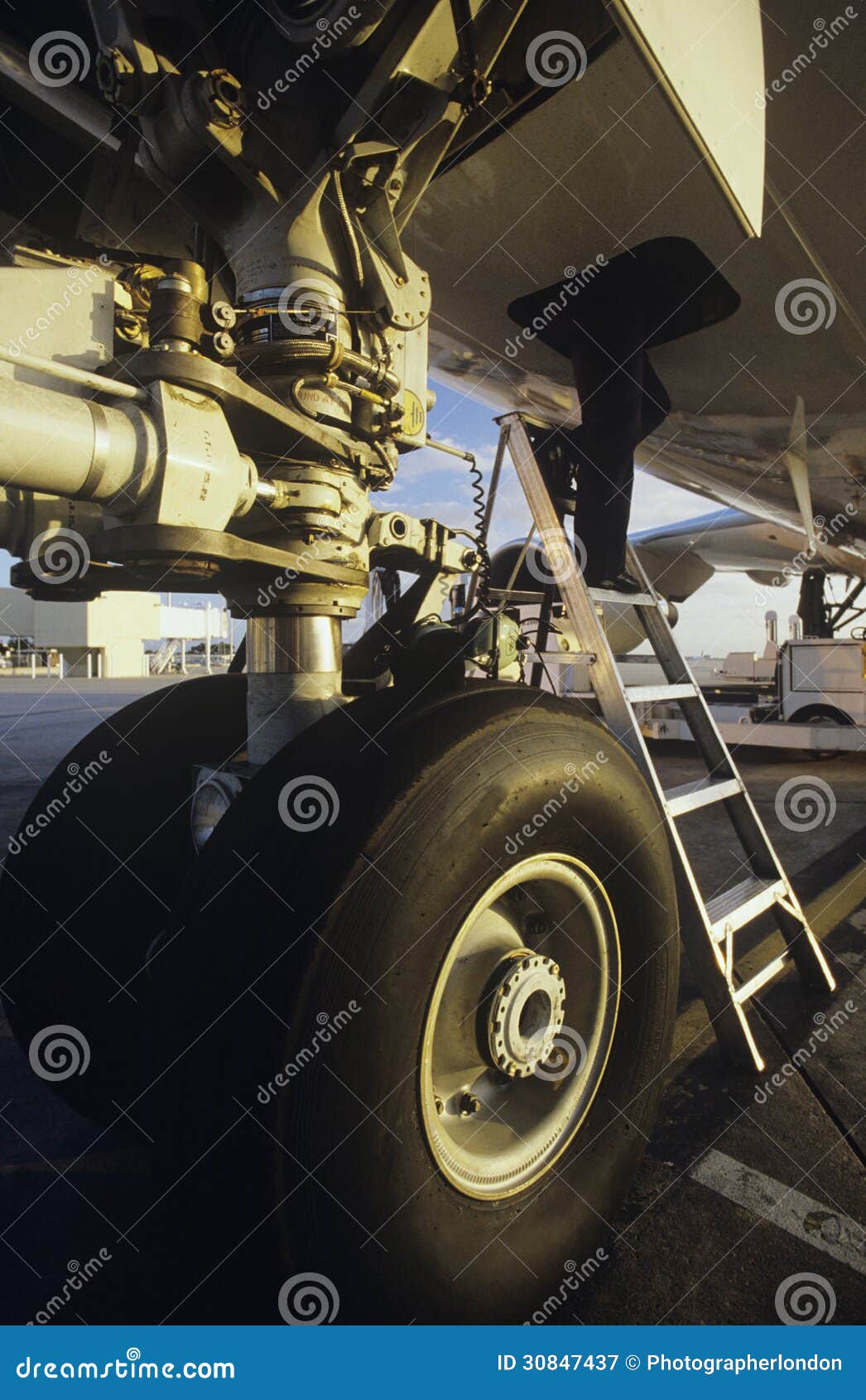 Aircraft Maintenance Mechanics Inspecting And Working On Airplane Jet ...