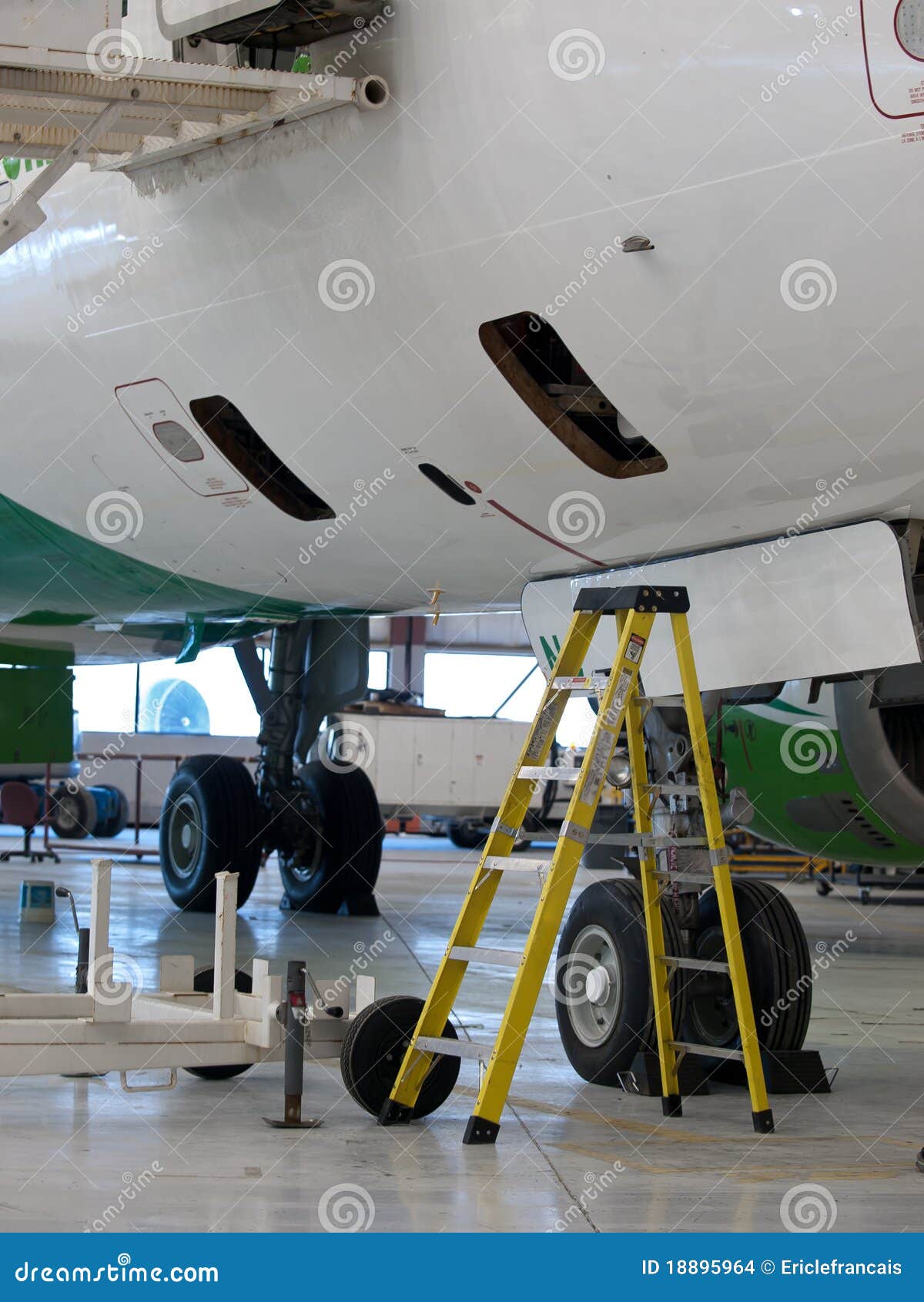 Aircraft Maintenance Mechanics Inspecting And Working On Airplane Jet ...