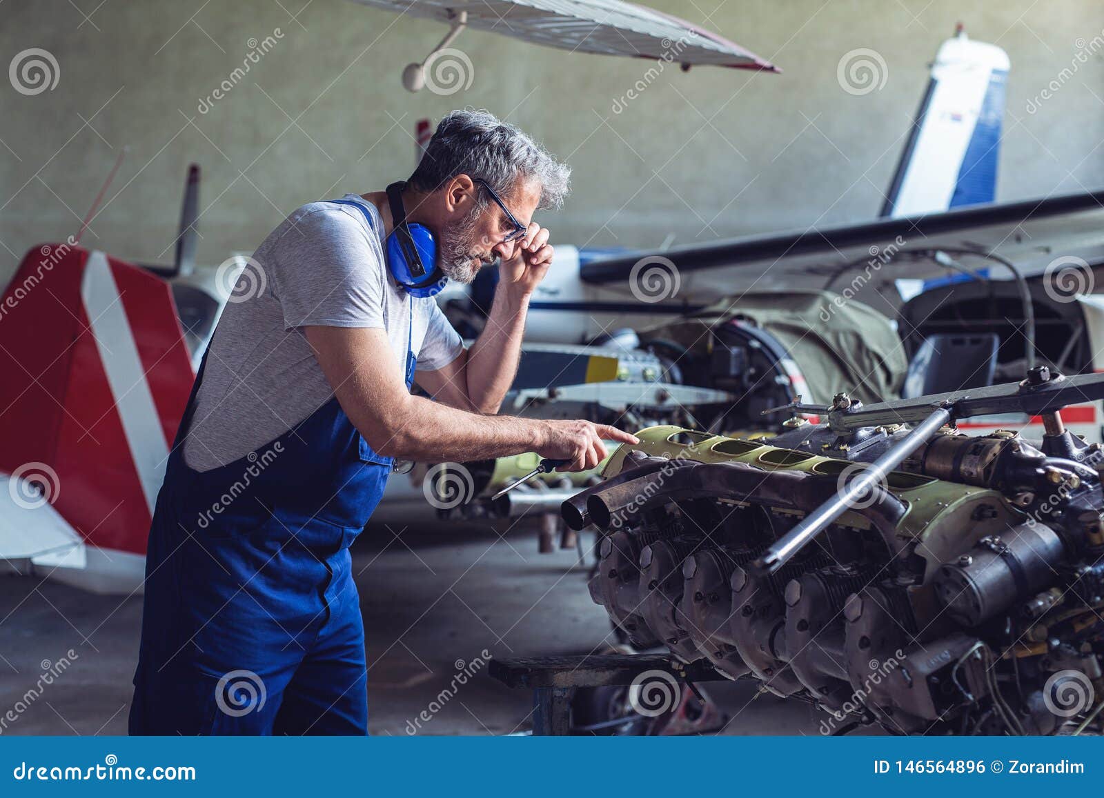 Aircraft Mechanic Repairing Jet Engine Stock Photo - Image of airport ...
