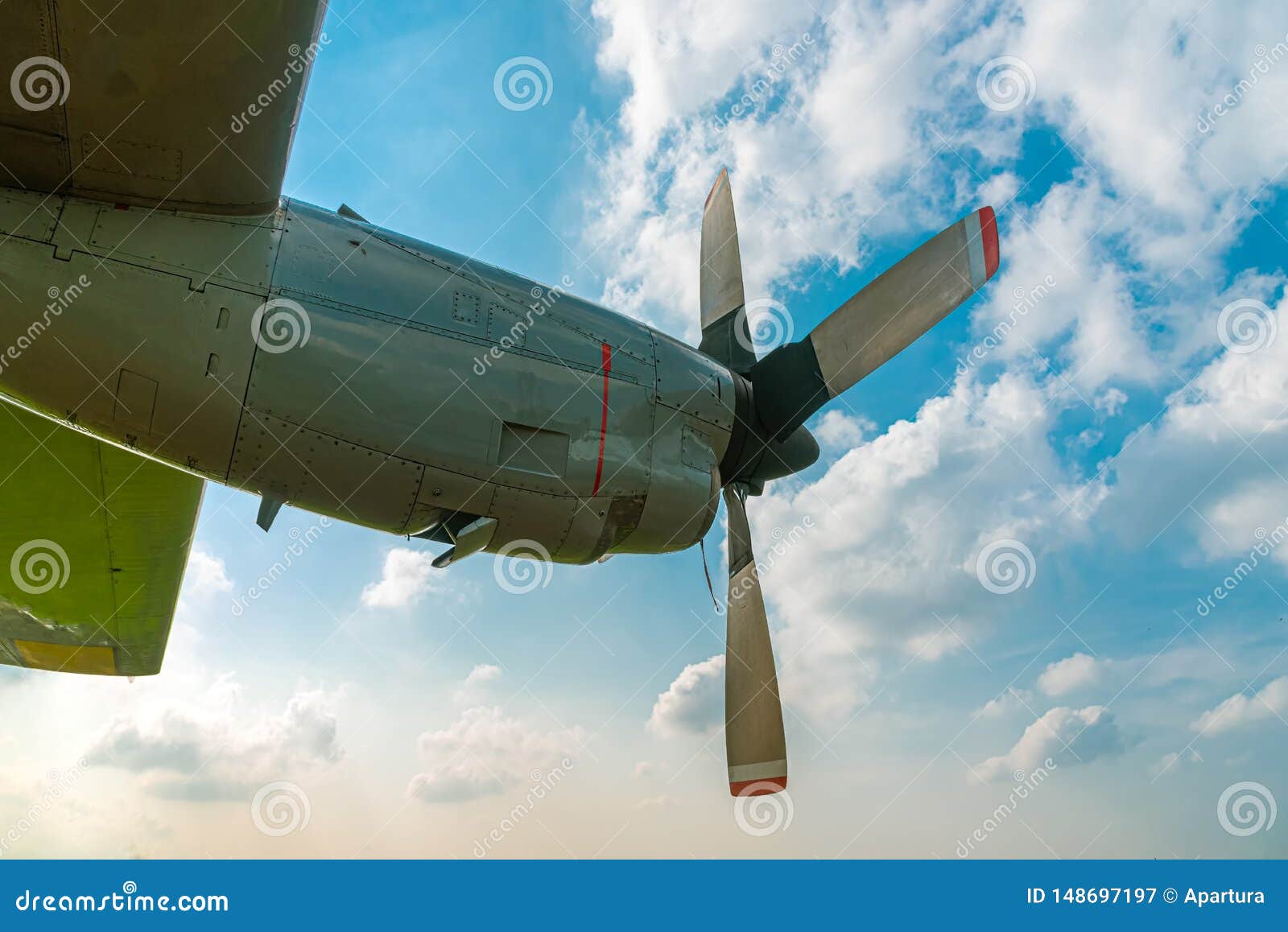 Aircraft Propeller and Spinner Engine on Airplane Wing Against Cloudy ...