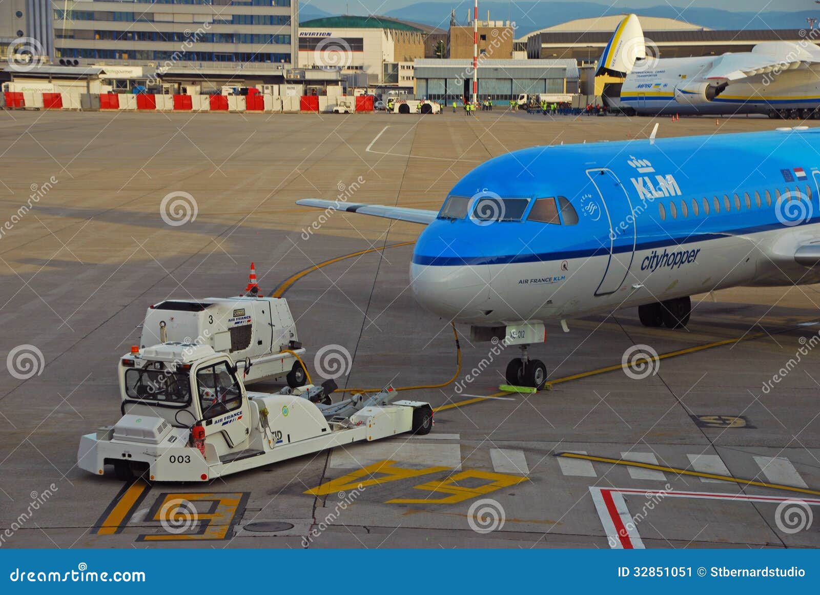 An Aircraft Tow Tractor Moving a Plane Editorial Photo - Image of plane ...