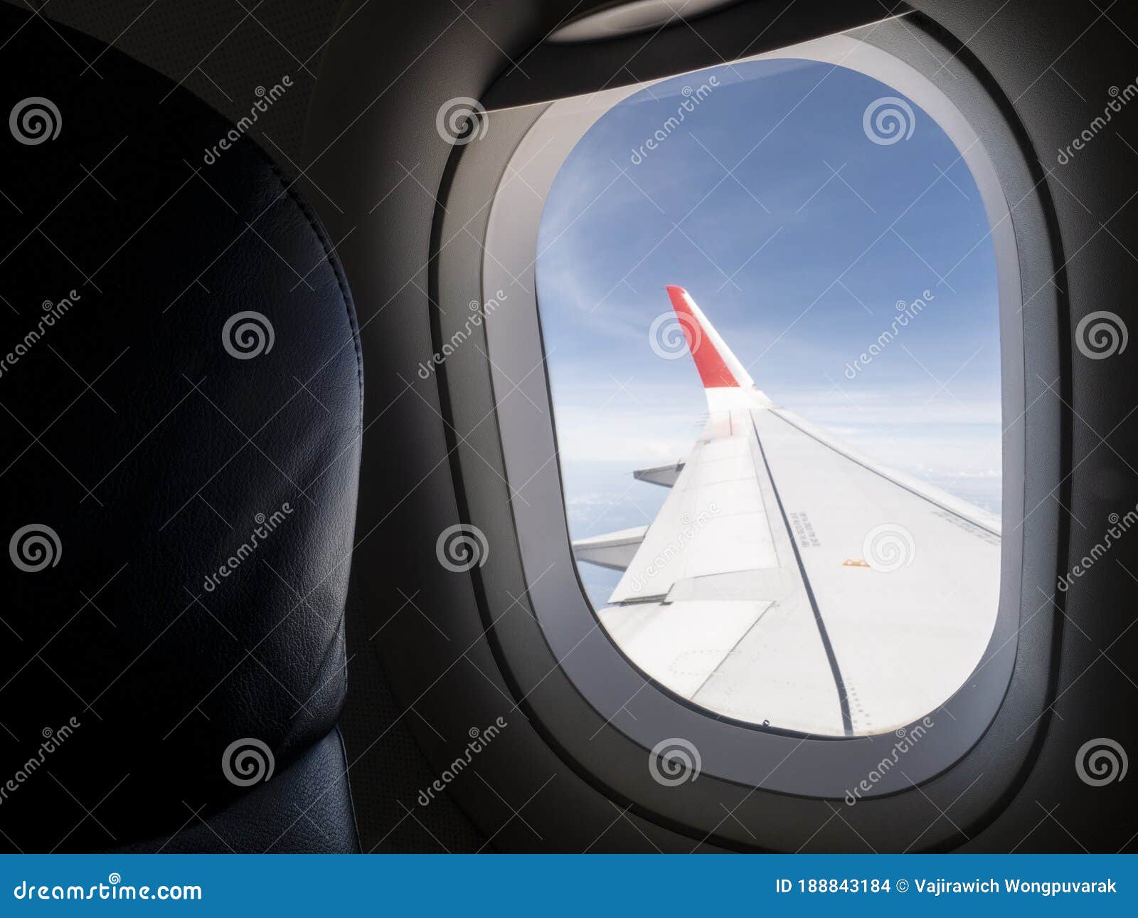Aircraft Window Frame from Seat. Wing and Sky in Background ...