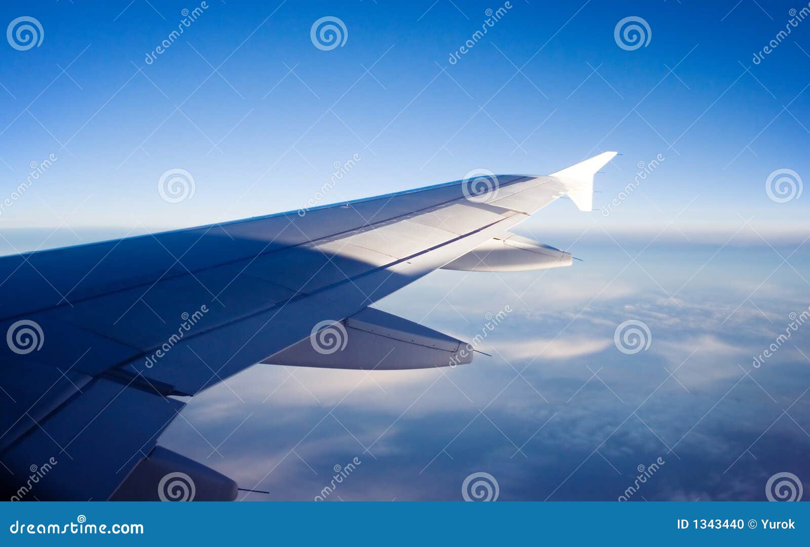 View On Passenger Aircraft Right Wing. Sunset Shines As A Golden Light ...