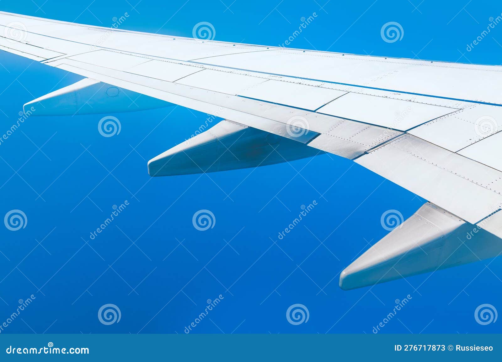 Aircraft wing in flight stock image. Image of transportation - 276717873