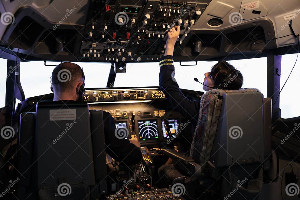 Aircrew Members Flying Airplane with Dashboard Command Stock Image ...