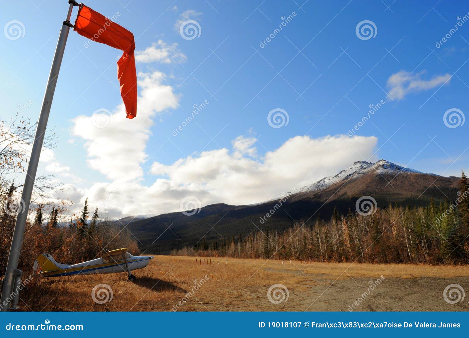 Airfield with an Aircraft and a Windsock Stock Image - Image of ...