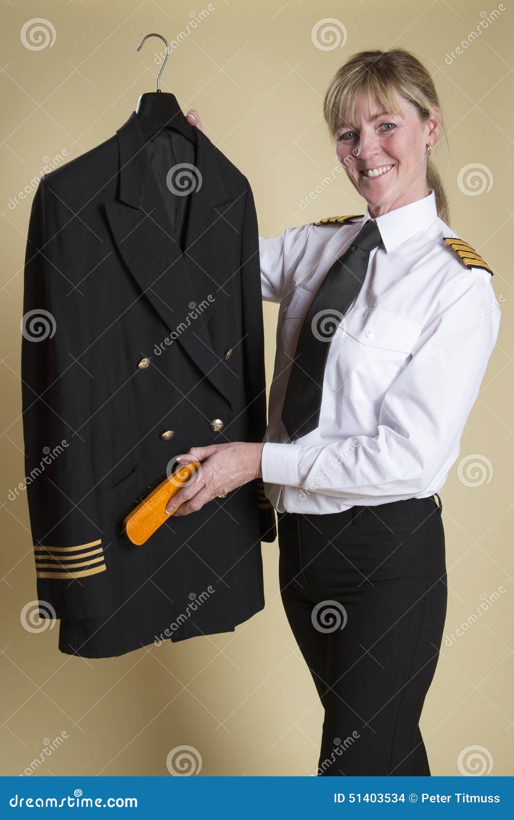Airline Pilot Brushing Uniform Jacket Royalty-Free Stock Image ...
