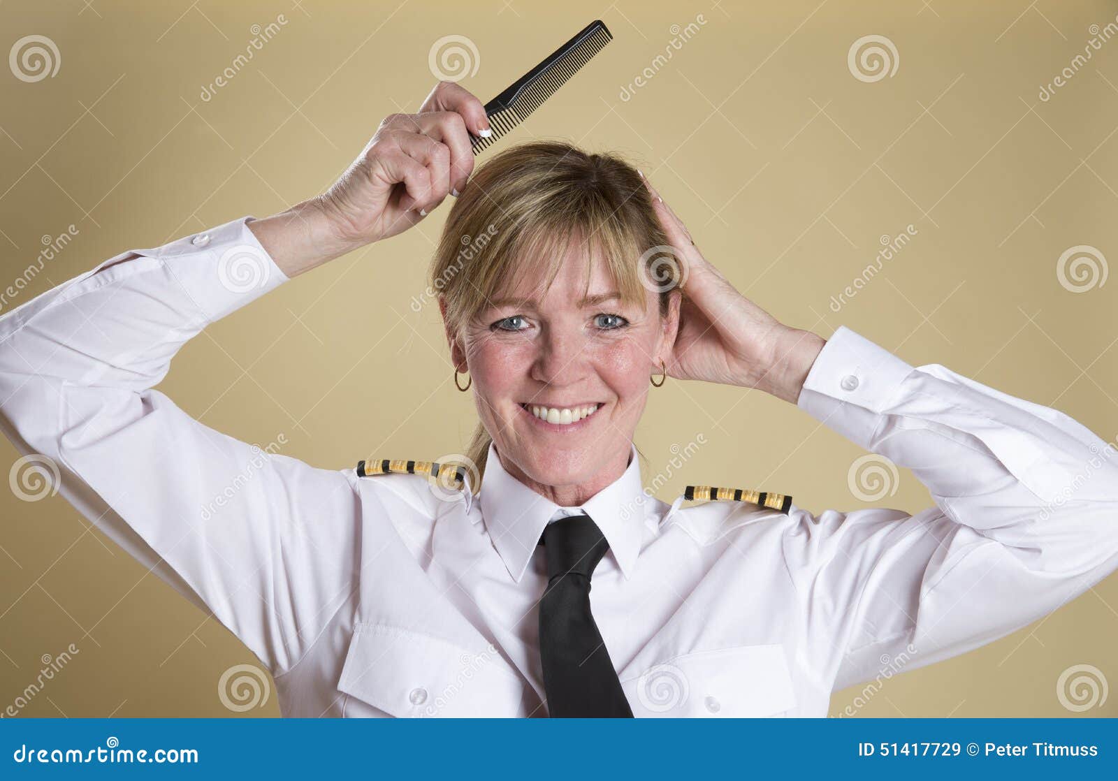 Airline Pilot Combing Her Hair Stock Image - Image of gold, expression ...