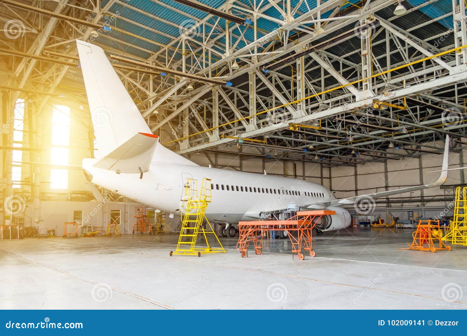 Airliner Aircraft in a Hangar with an Open Gate To the Service. Stock ...
