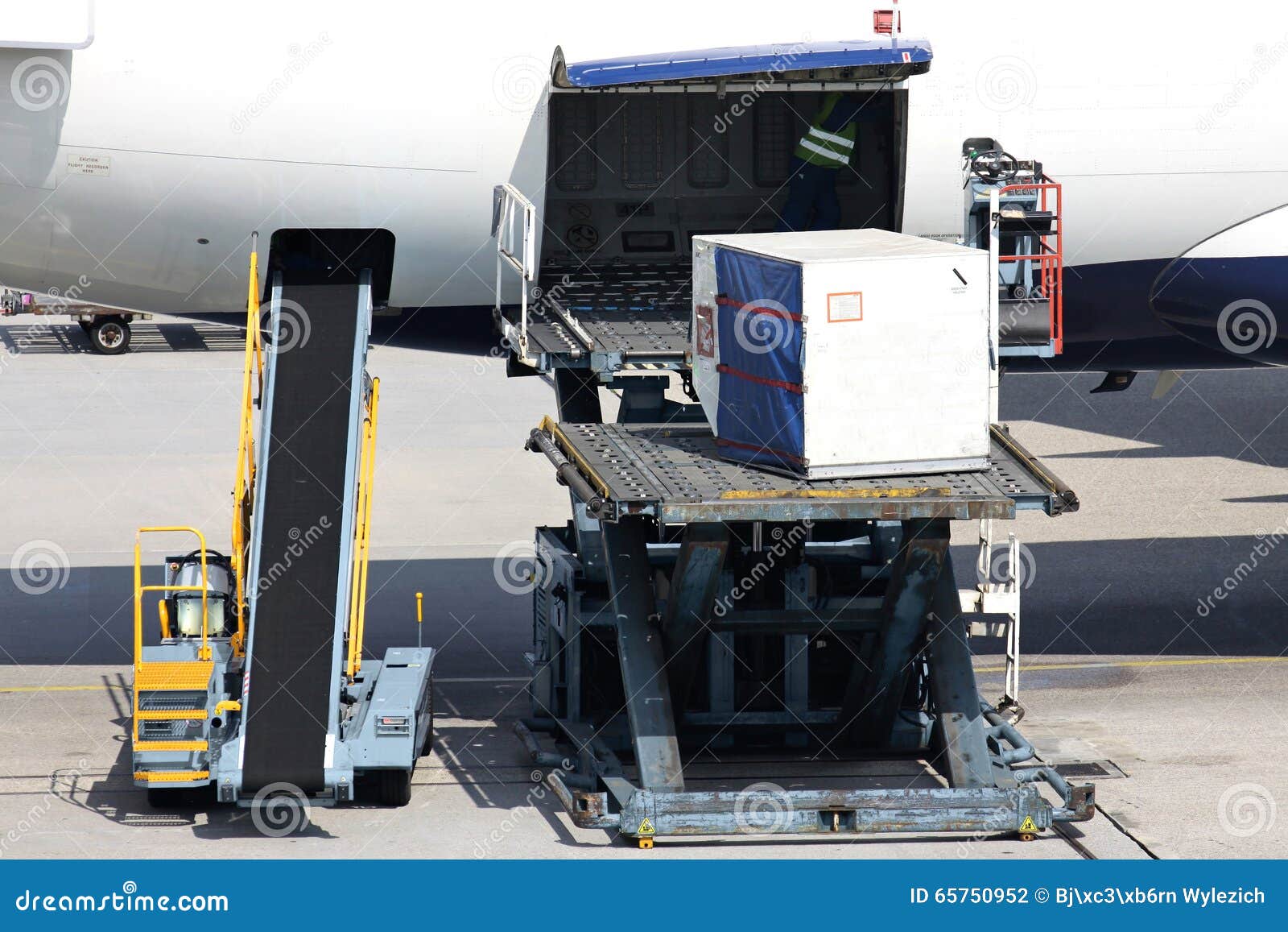 Airliner being loaded stock photo. Image of loaders, apron - 65750952