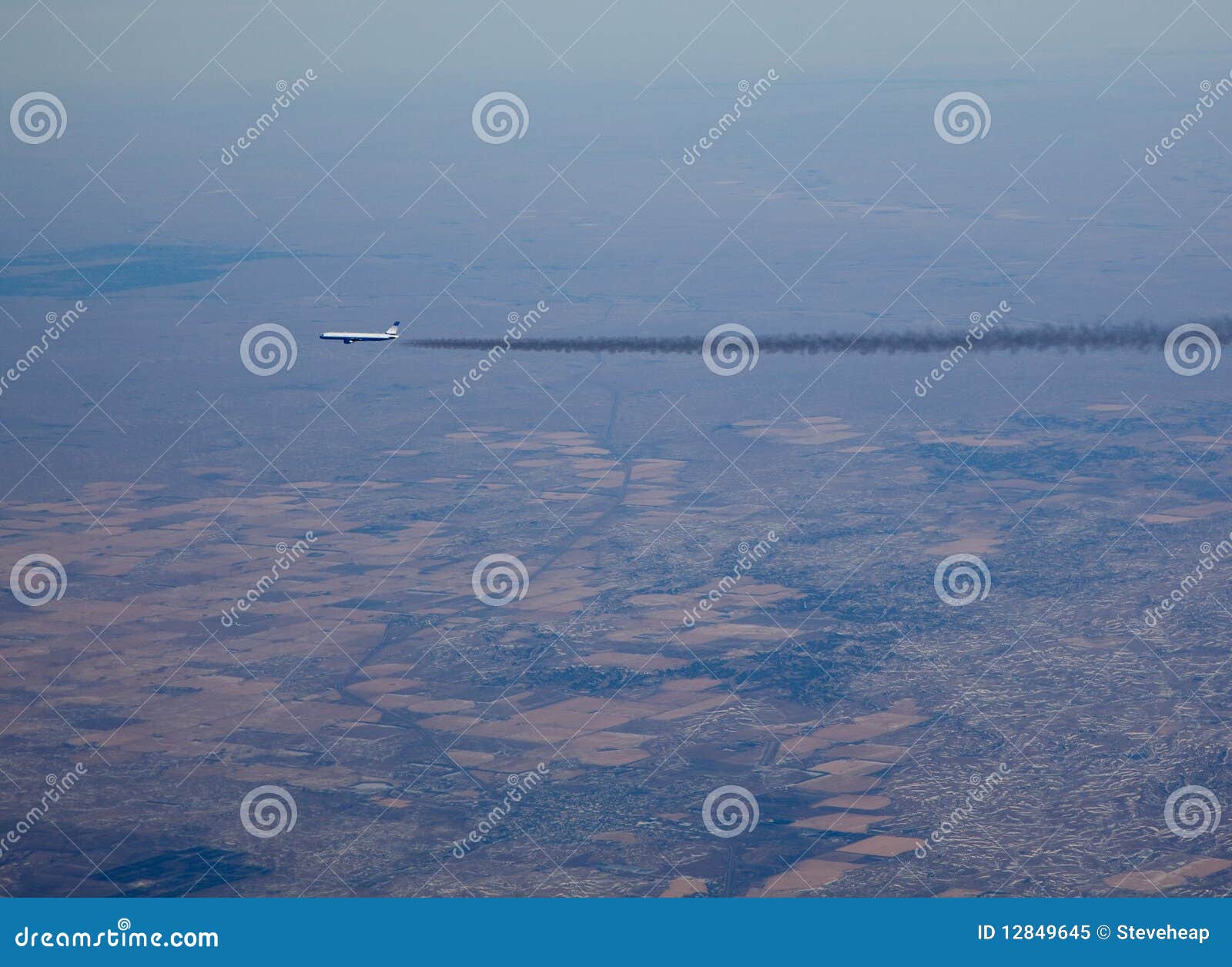 Airliner with Long Smoke Plume Stock Image - Image of dust, plane: 12849645