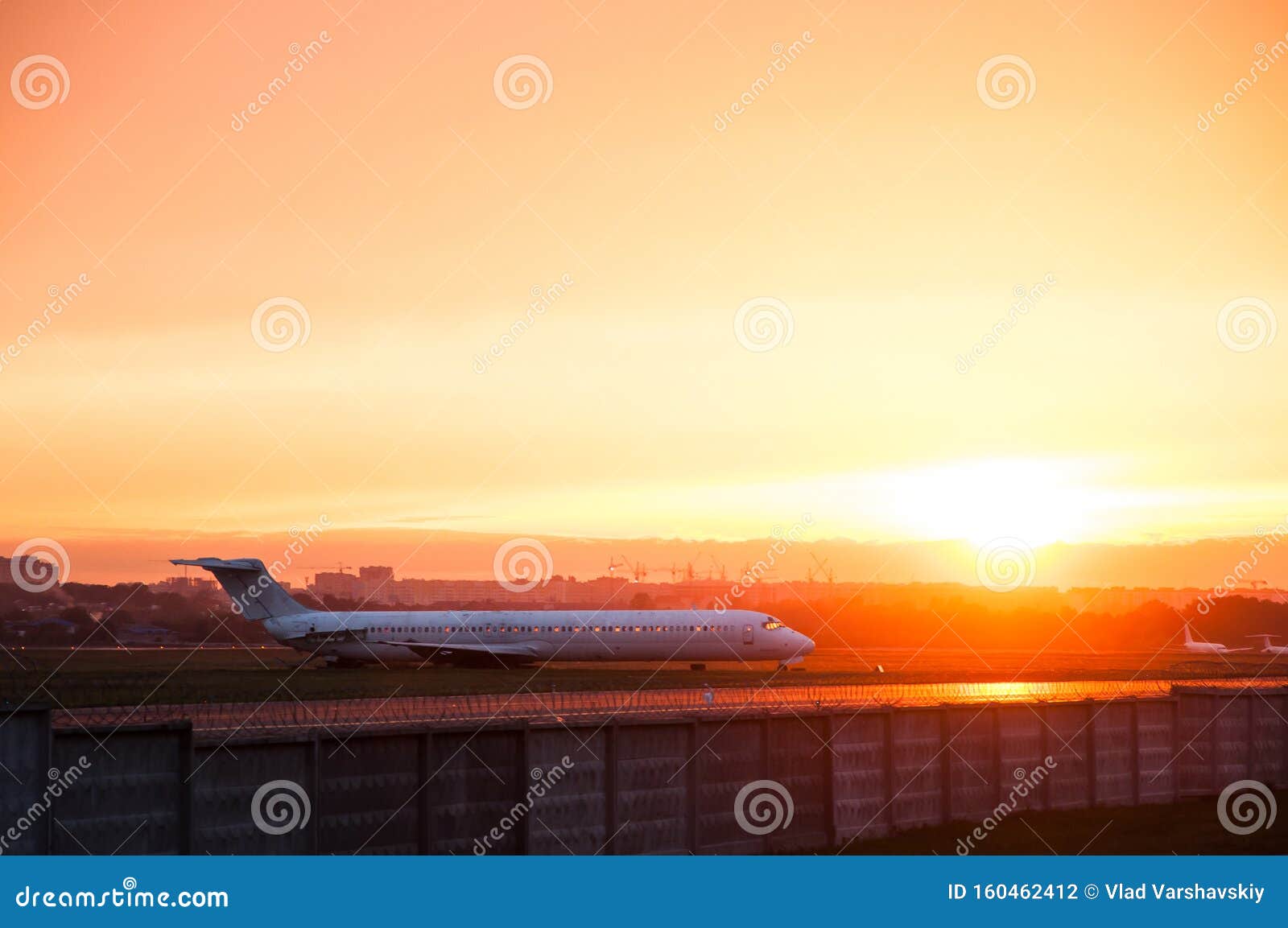 Airplane at the Airport at Sunset. Passenger Plane Stock Photo - Image ...
