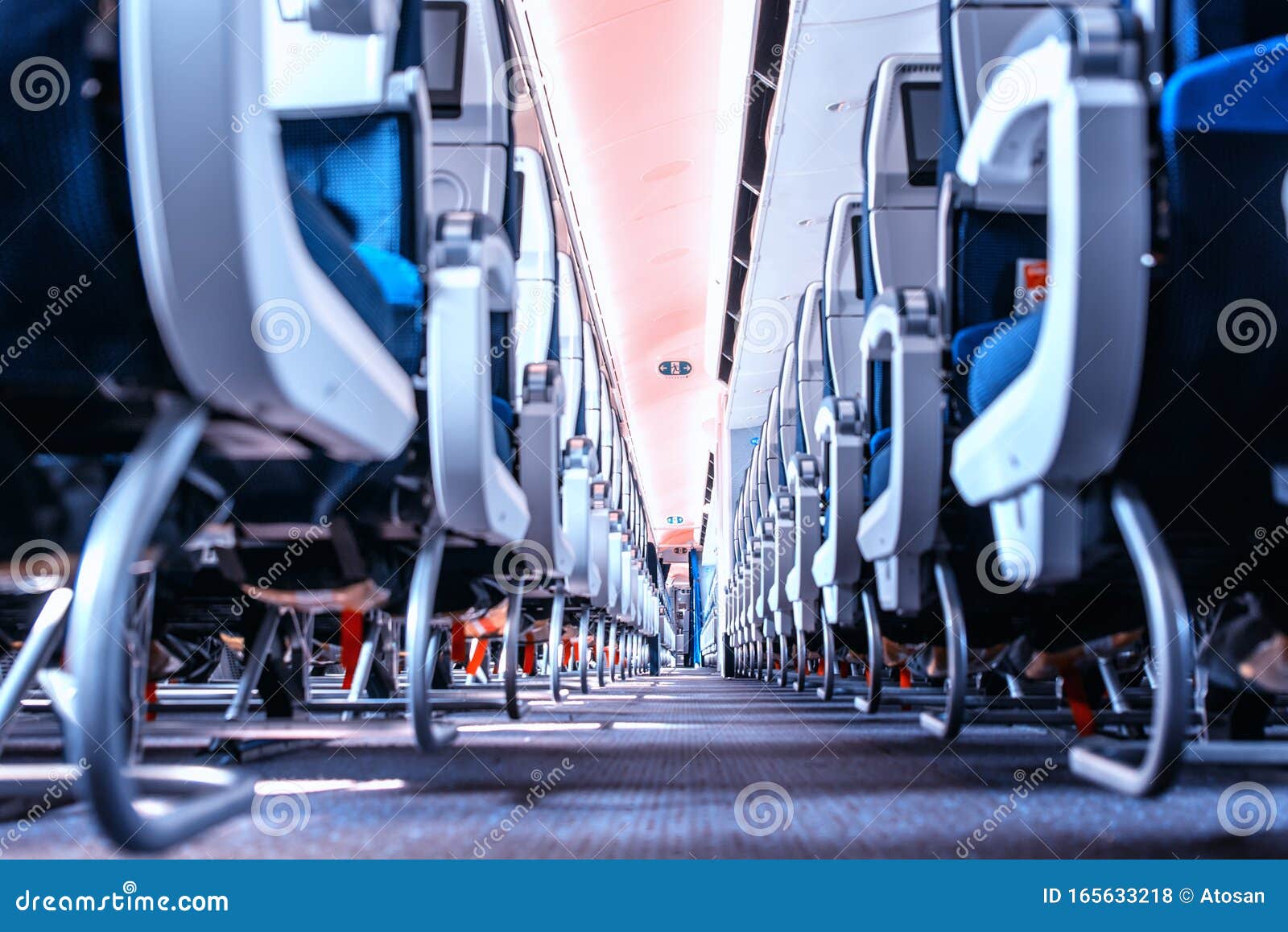 Airplane aisle stock photo. Image of person, aisle, indoors - 165633218