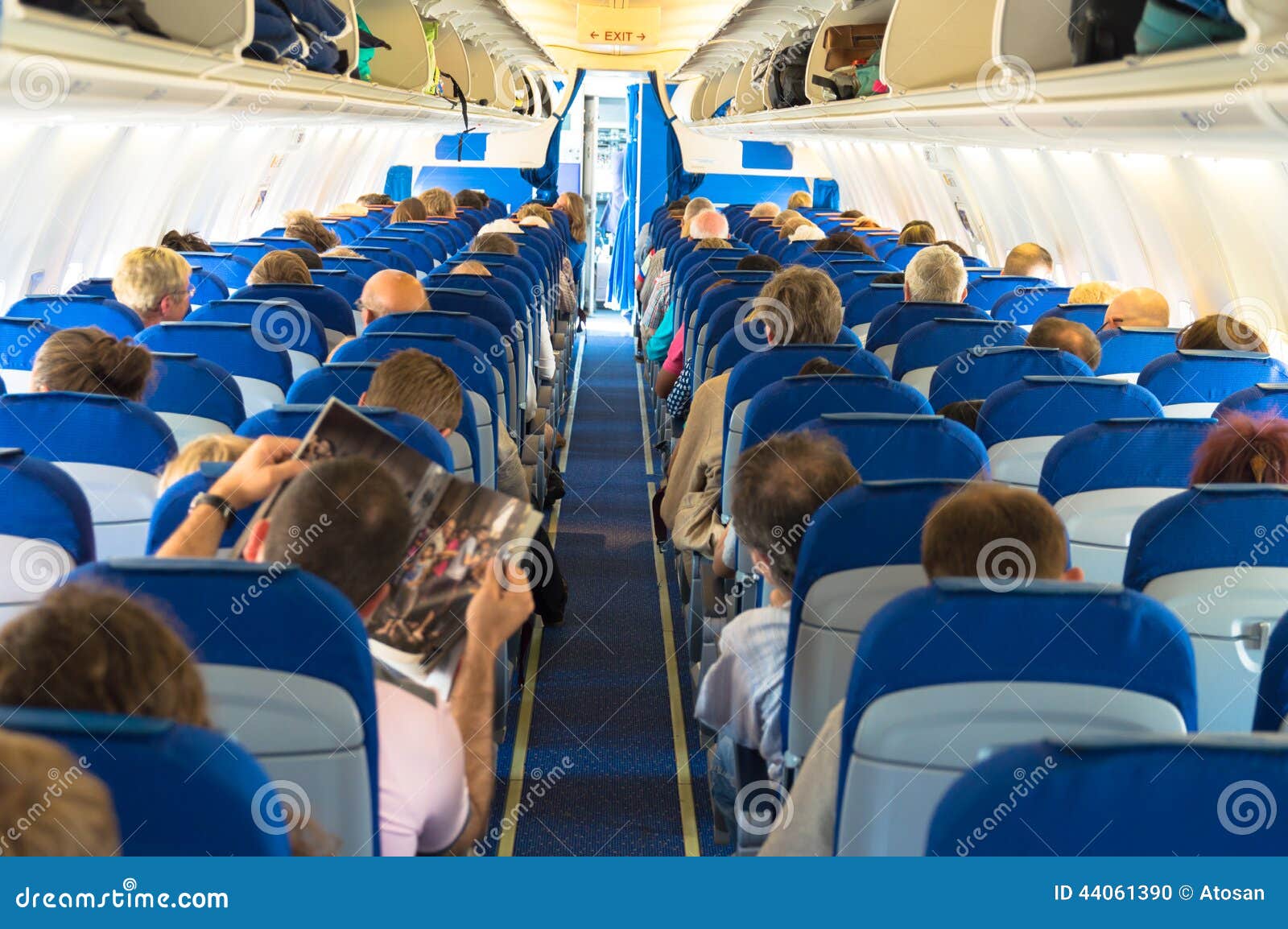 Airplane Aisle with Rear View of Passengers Editorial Image - Image of ...