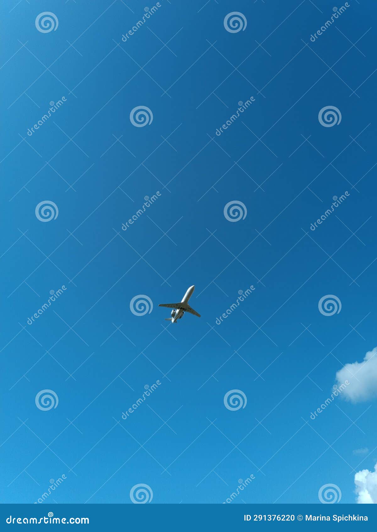 Airplane on the Background of a Blue Sky View from Below Stock Photo ...