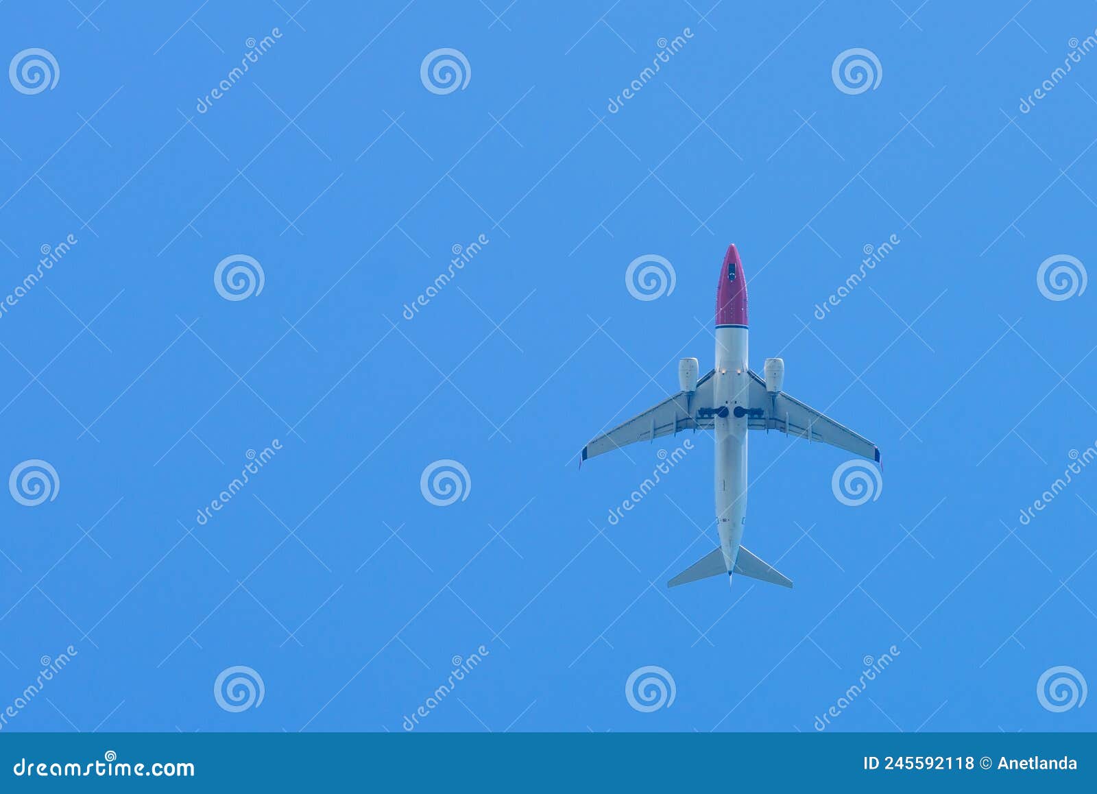 Airplane in the blue sky stock photo. Image of flight - 245592118
