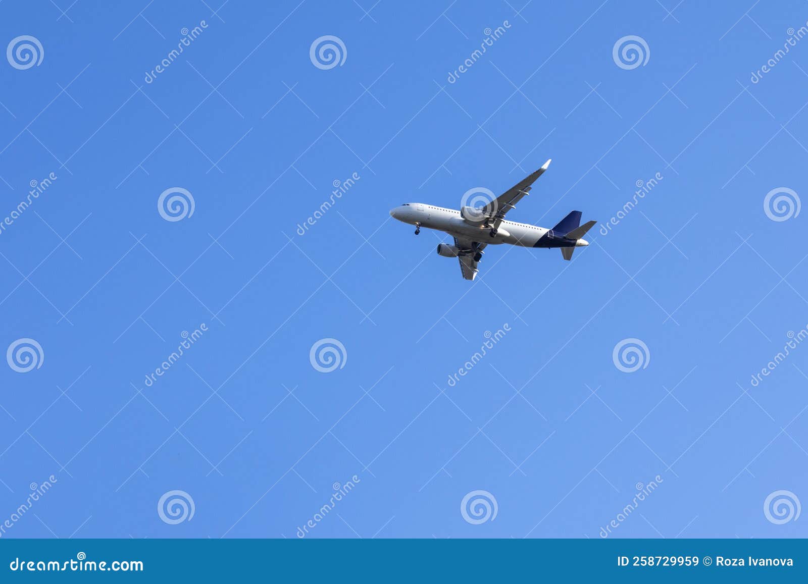 Airplane in Blue Sky with Light Clouds Over the House Stock Image ...