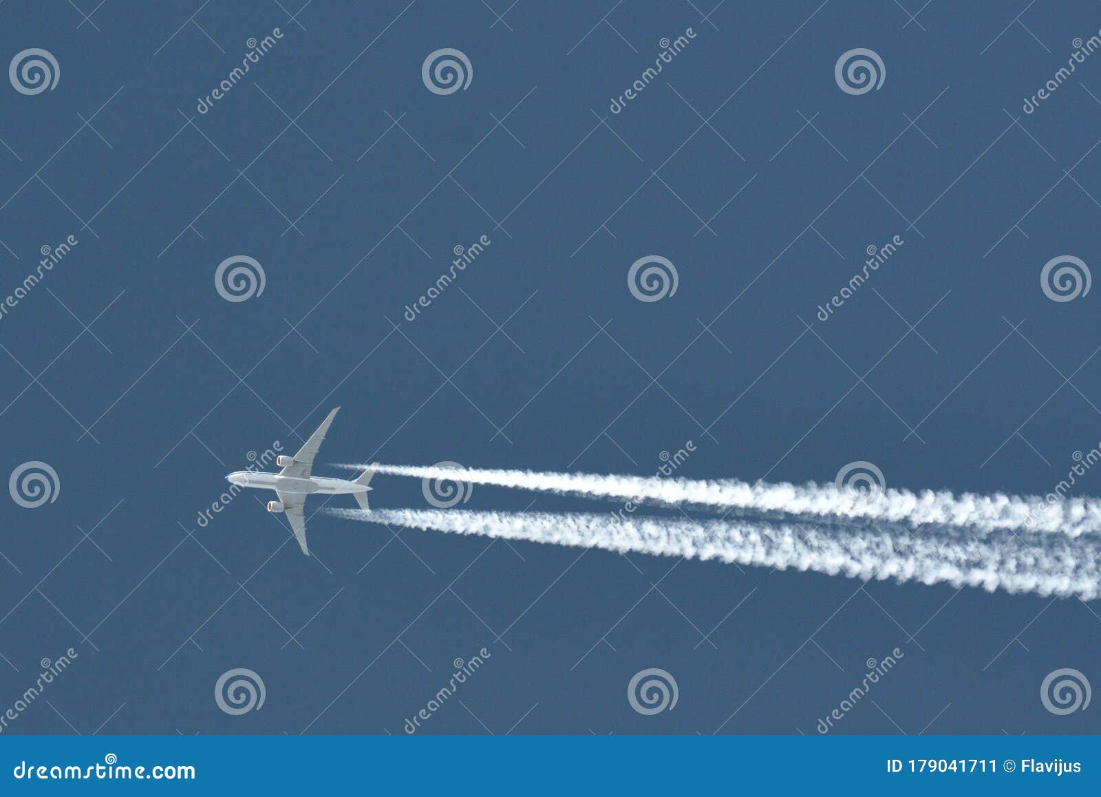 Airplane with Plane Trails stock image. Image of cloud - 179041711
