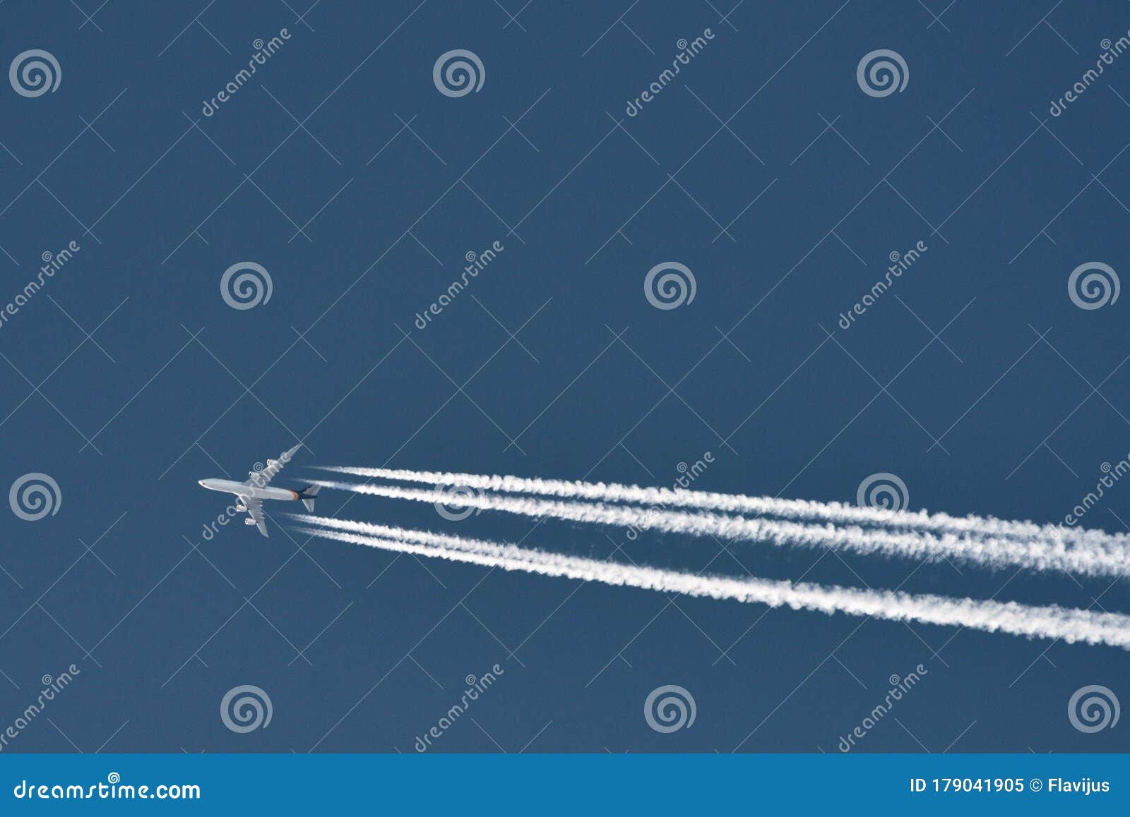Airplane with Plane Trails stock image. Image of space - 179041905
