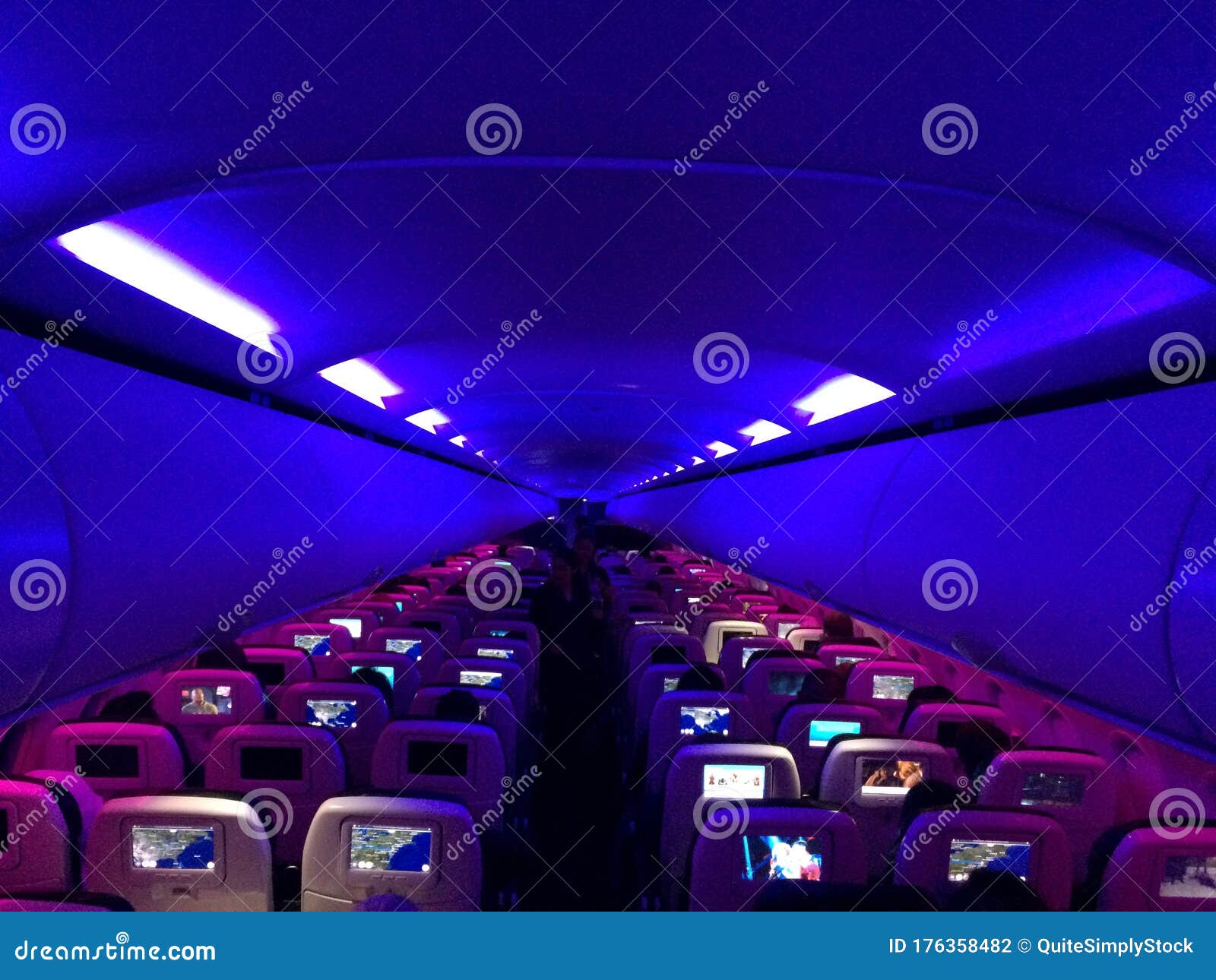 Airplane Cabin with Blue Light Editorial Photography - Image of meal ...