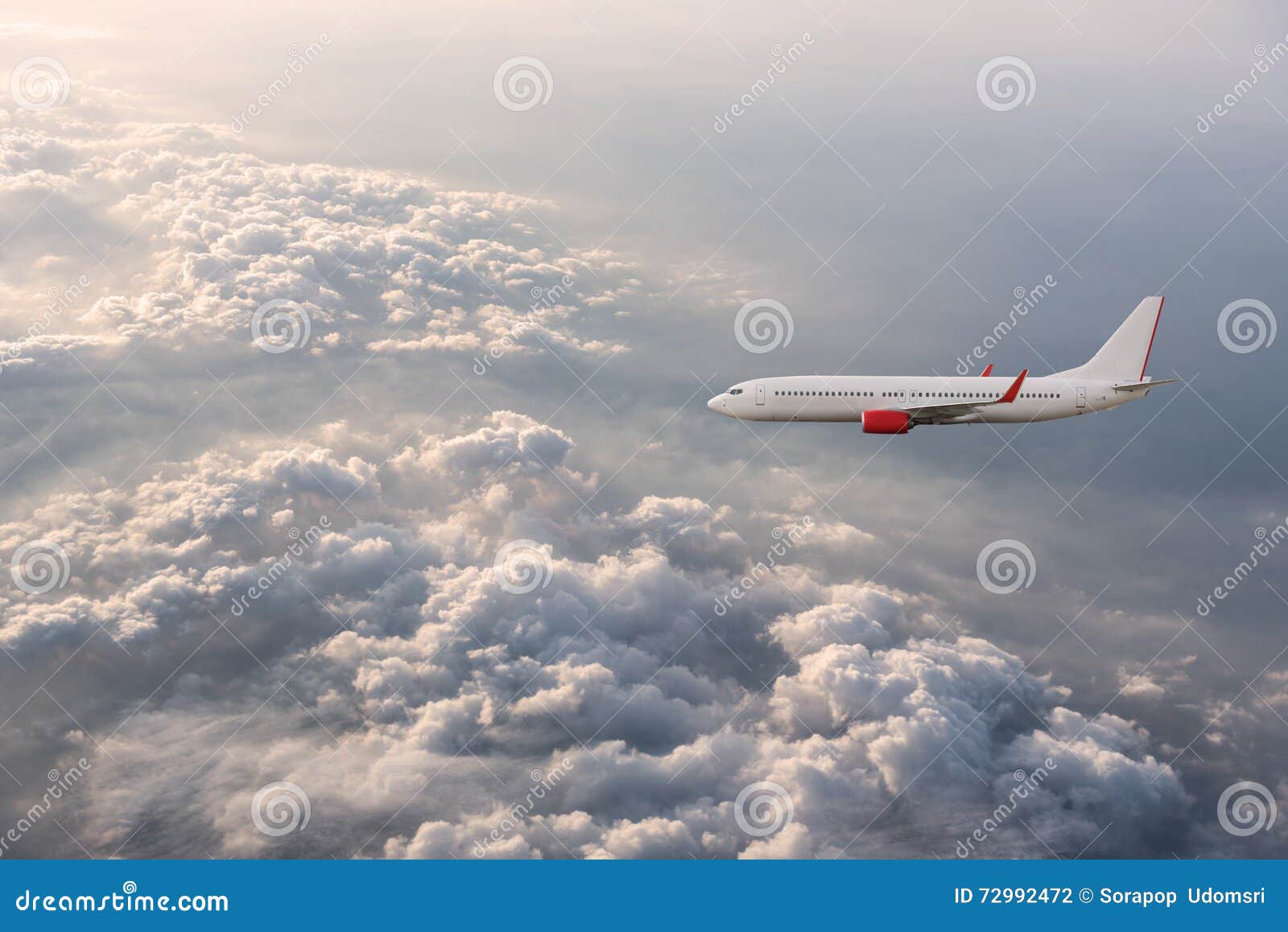 Airplane in the cloudy sky stock photo. Image of luxury - 72992472