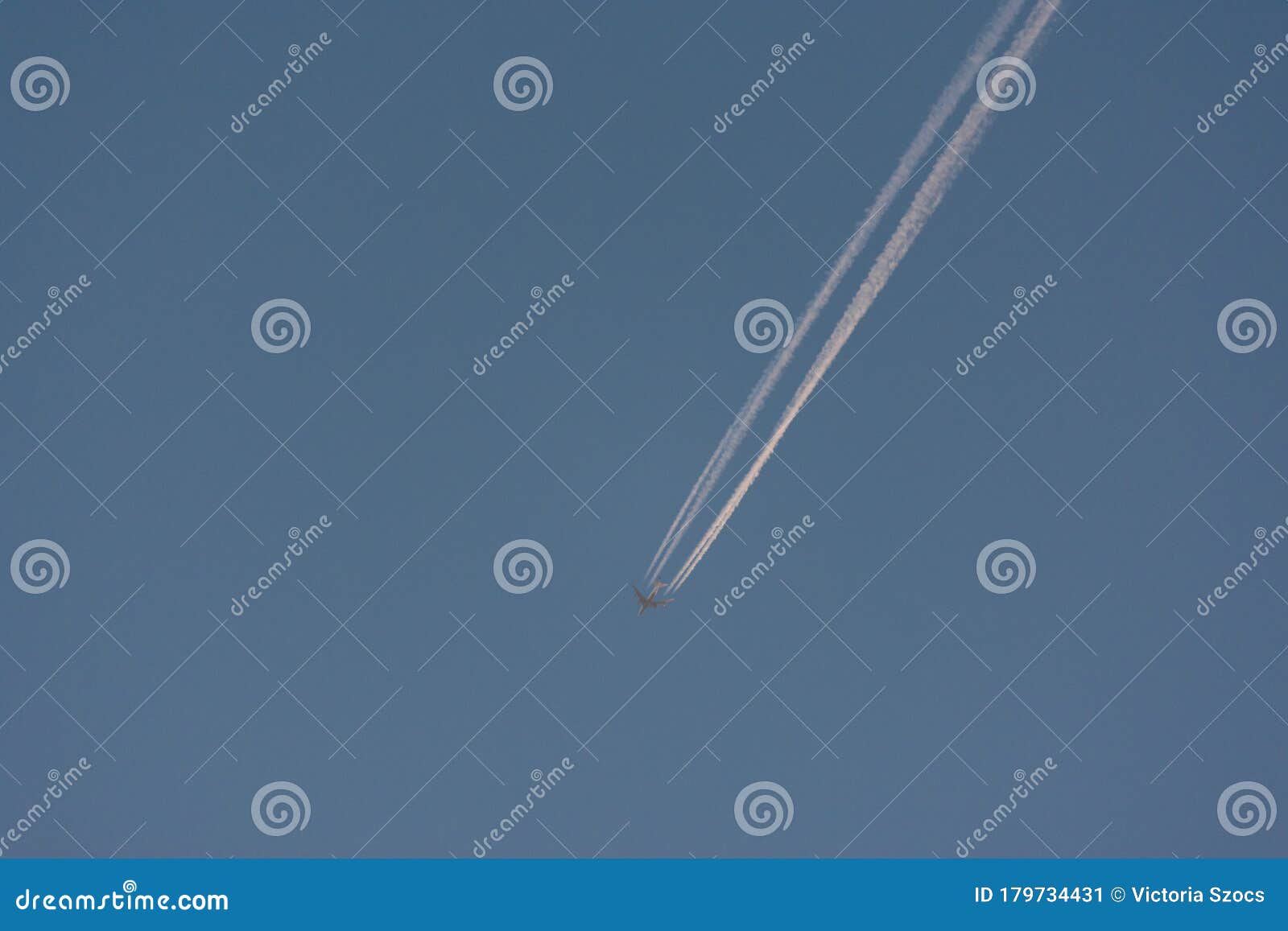 Airplane with contrail stock image. Image of aerial - 179734431
