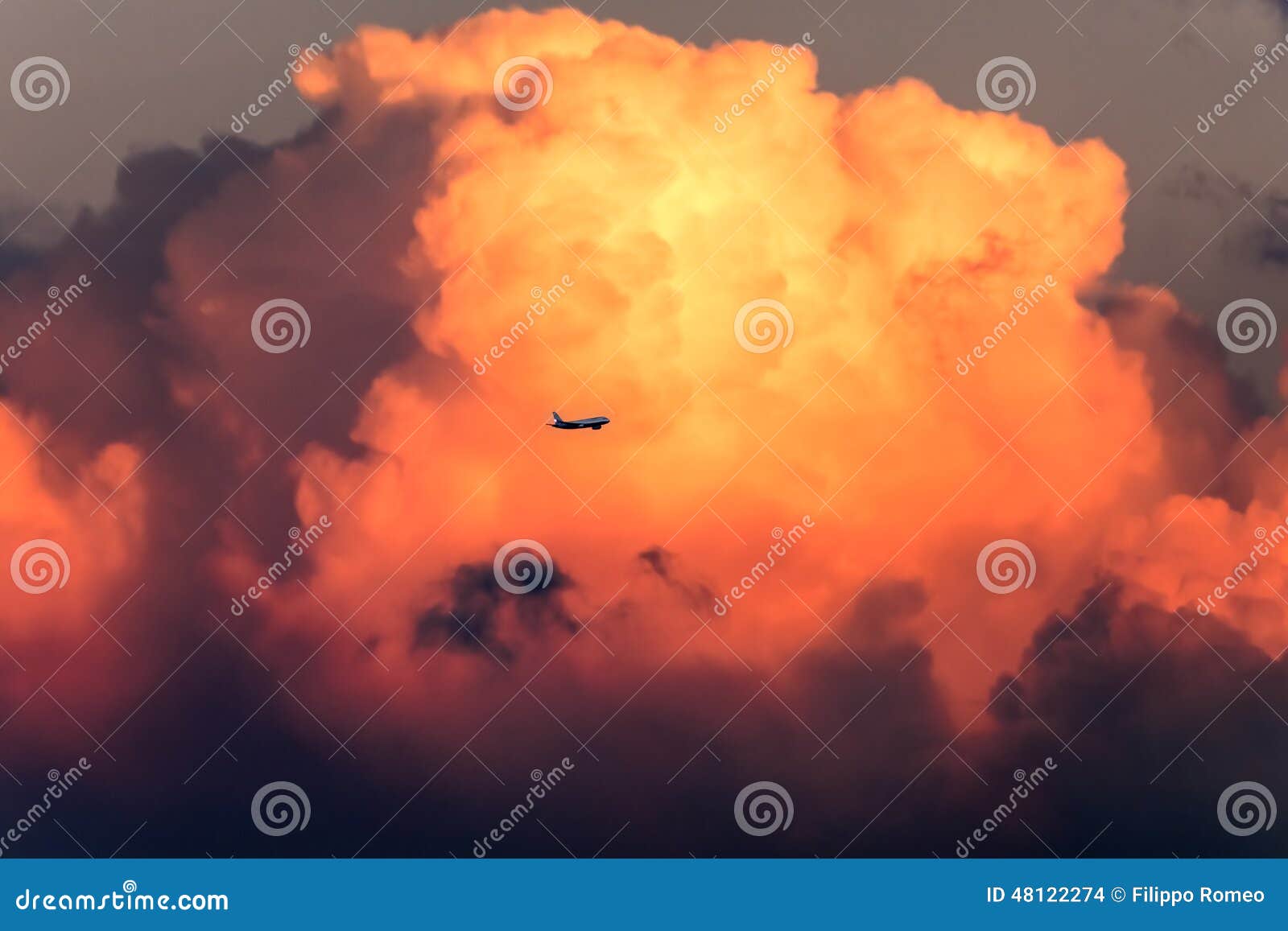 Airplane Crossing Red Clouds Stock Photo - Image of transportation ...