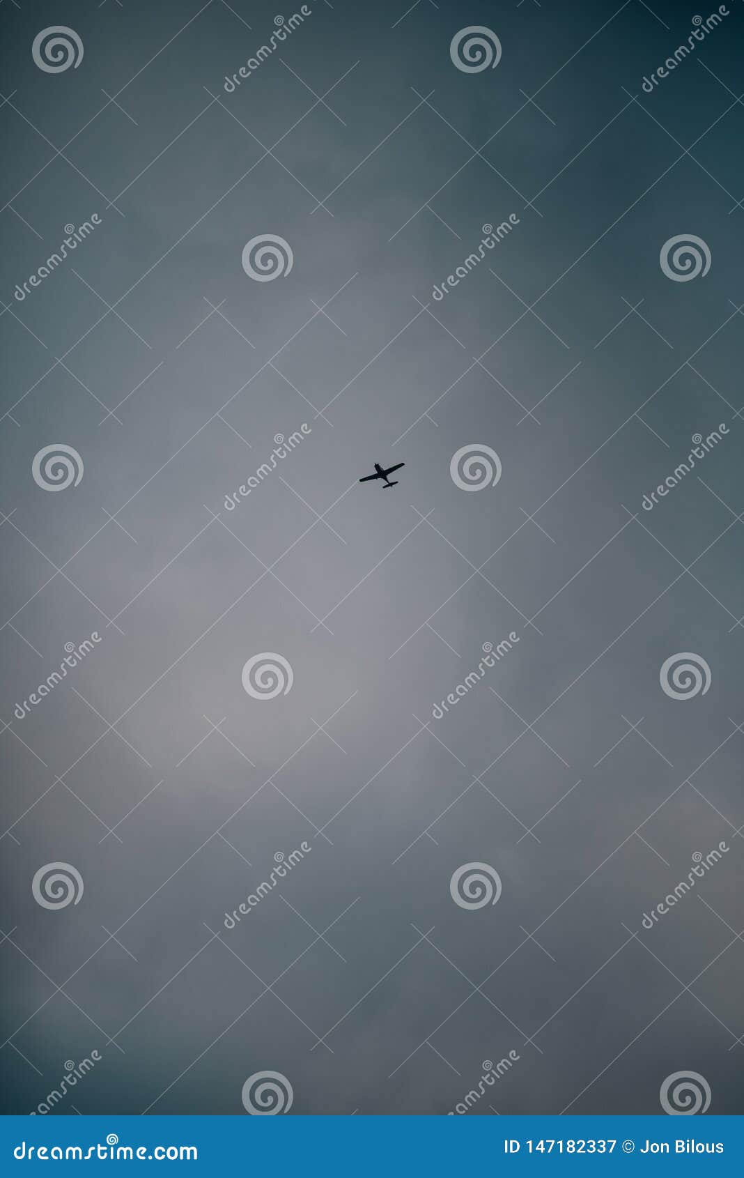 An airplane in a dark sky stock image. Image of airplane - 147182337