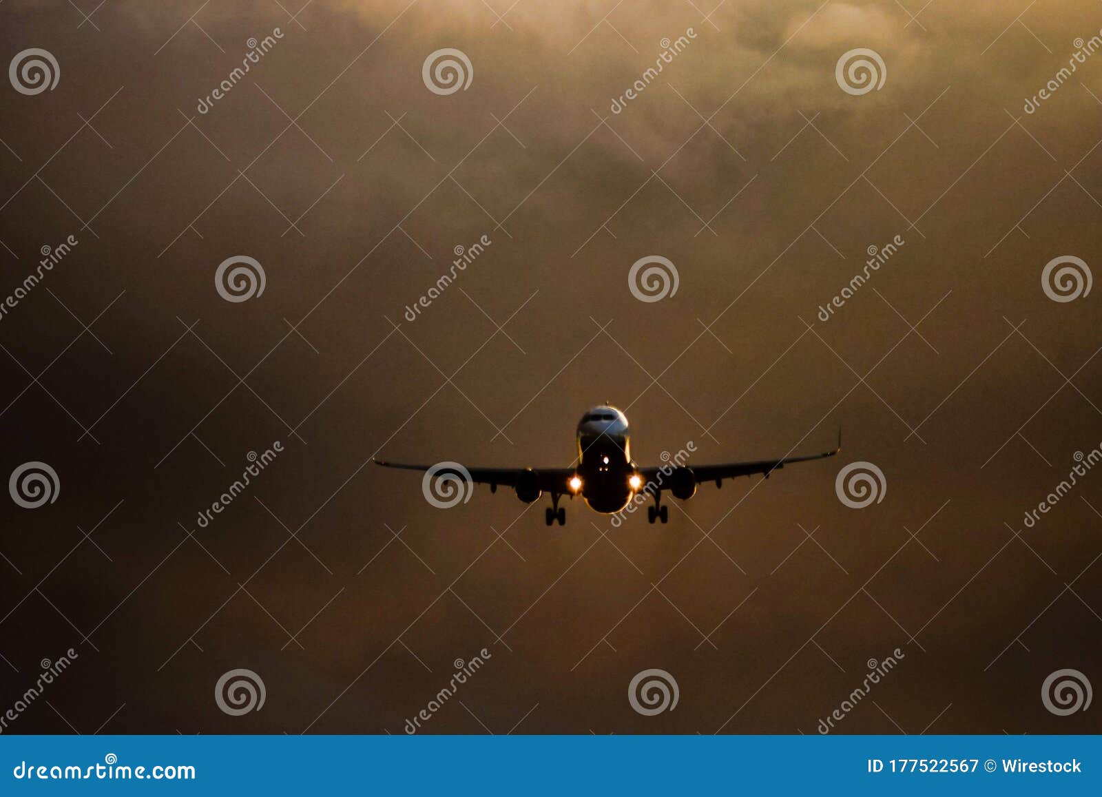 Airplane Descending from the Clouds with Two Lights on Stock Image ...