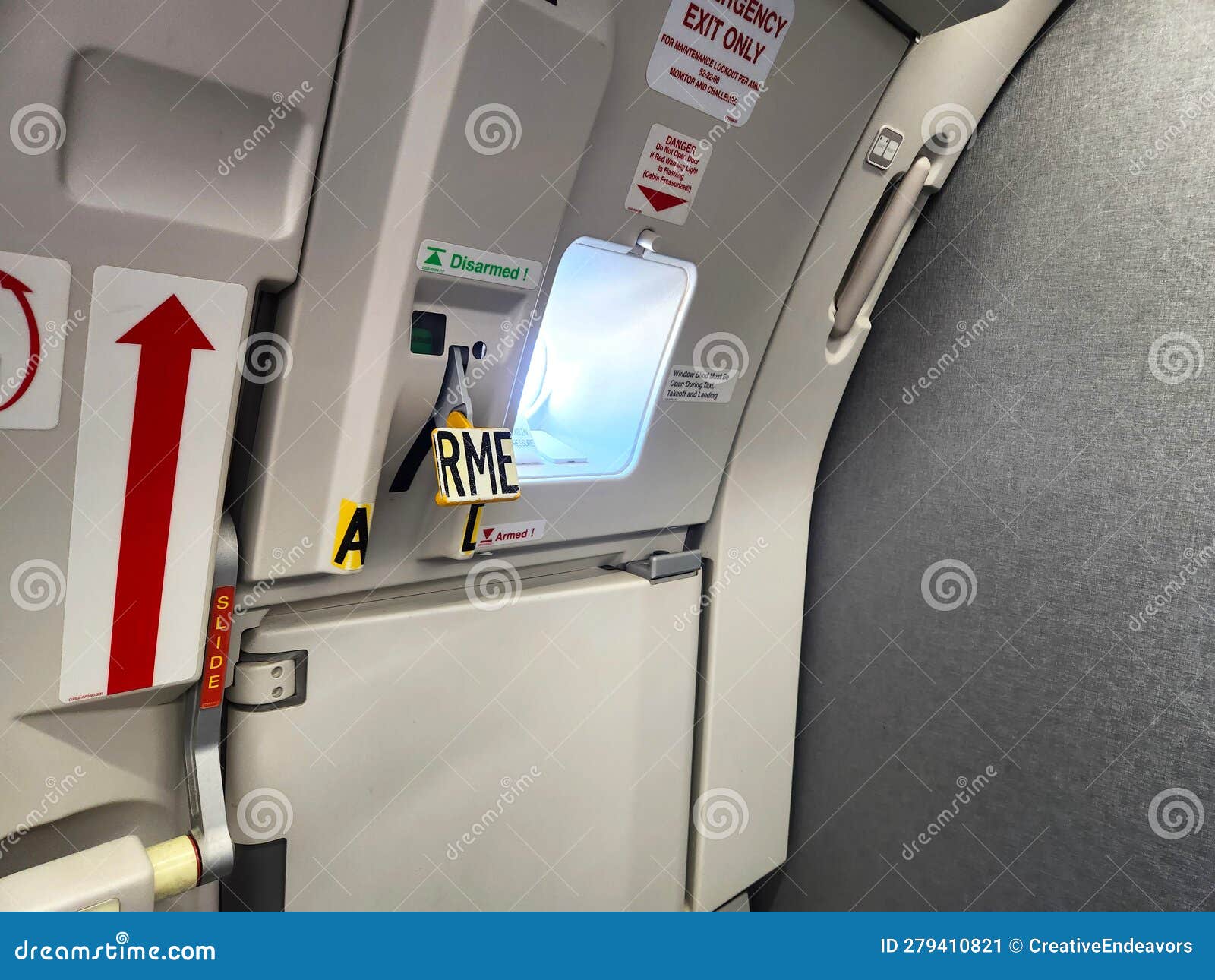 Airplane Exit Hatch with Warning Signs, Unarmed Stock Image - Image of ...