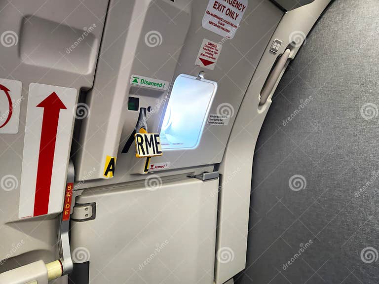 Airplane Exit Hatch with Warning Signs, Unarmed Stock Image - Image of ...
