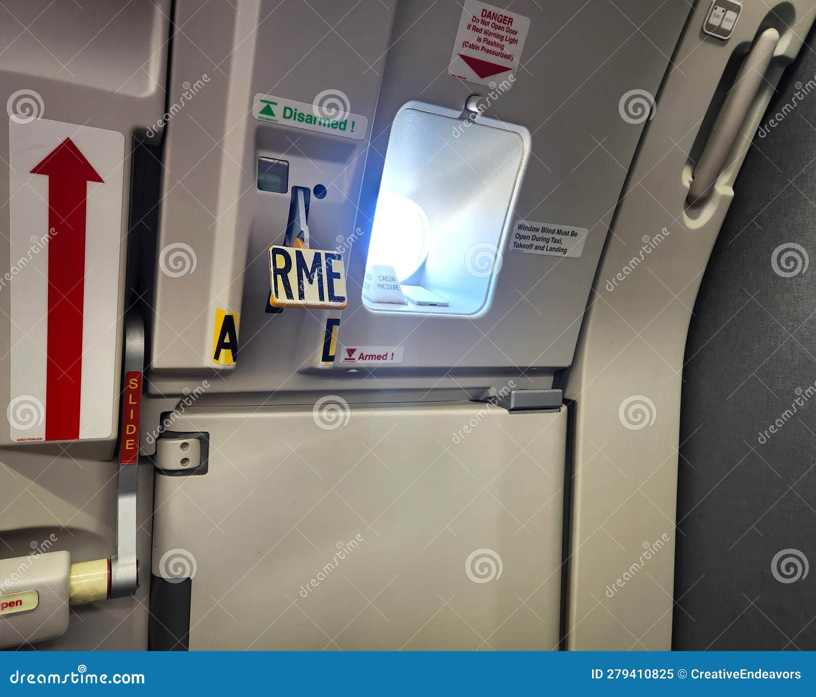 Airplane Exit Hatch with Warning Signs, Unarmed Stock Image - Image of ...