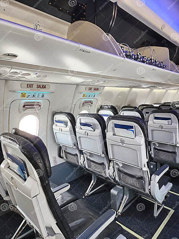 Airplane Exit Row Leg Space Stock Photo - Image of transport, airplane ...