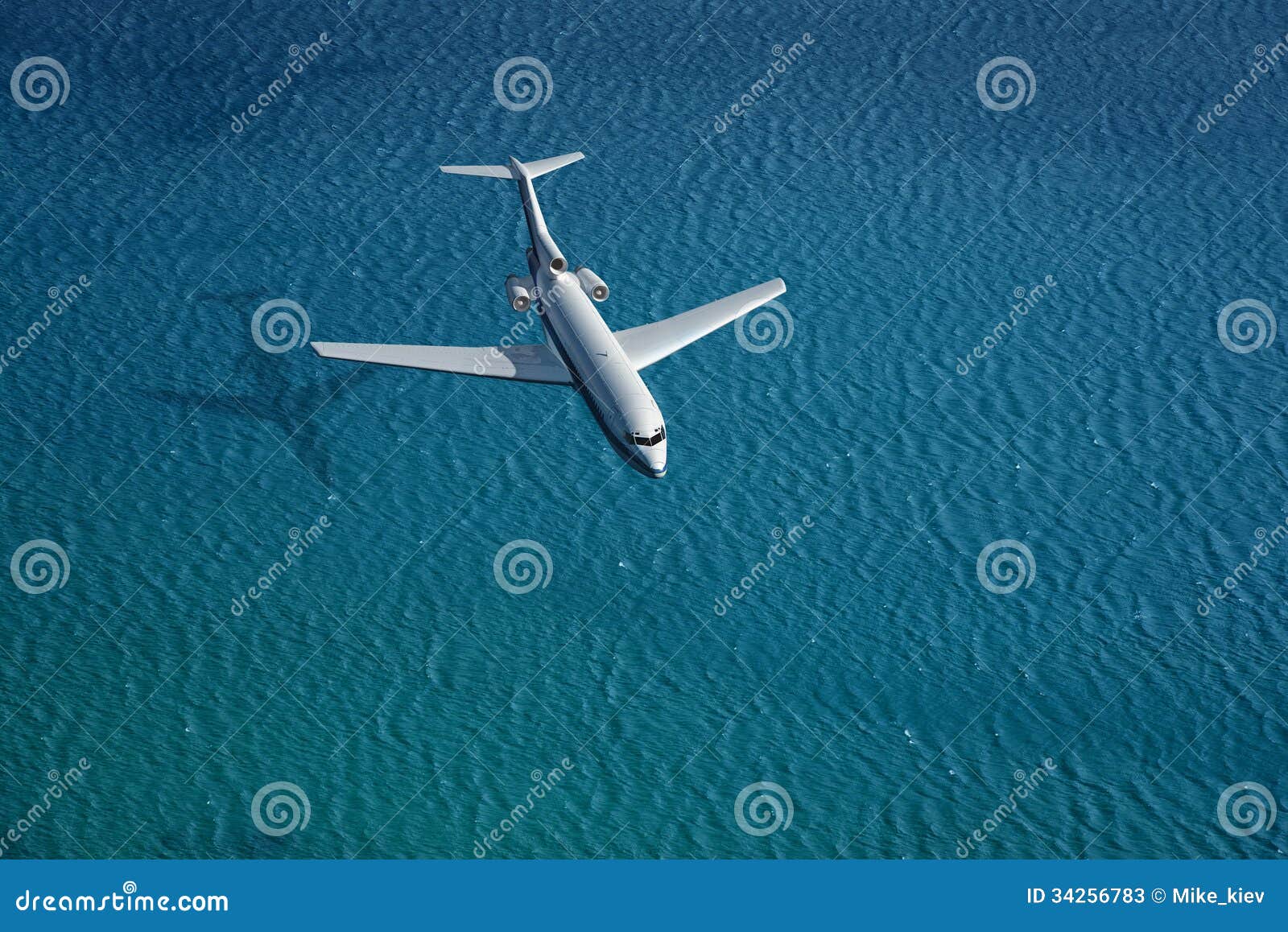 Airplane flies over a sea stock image. Image of blue - 34256783