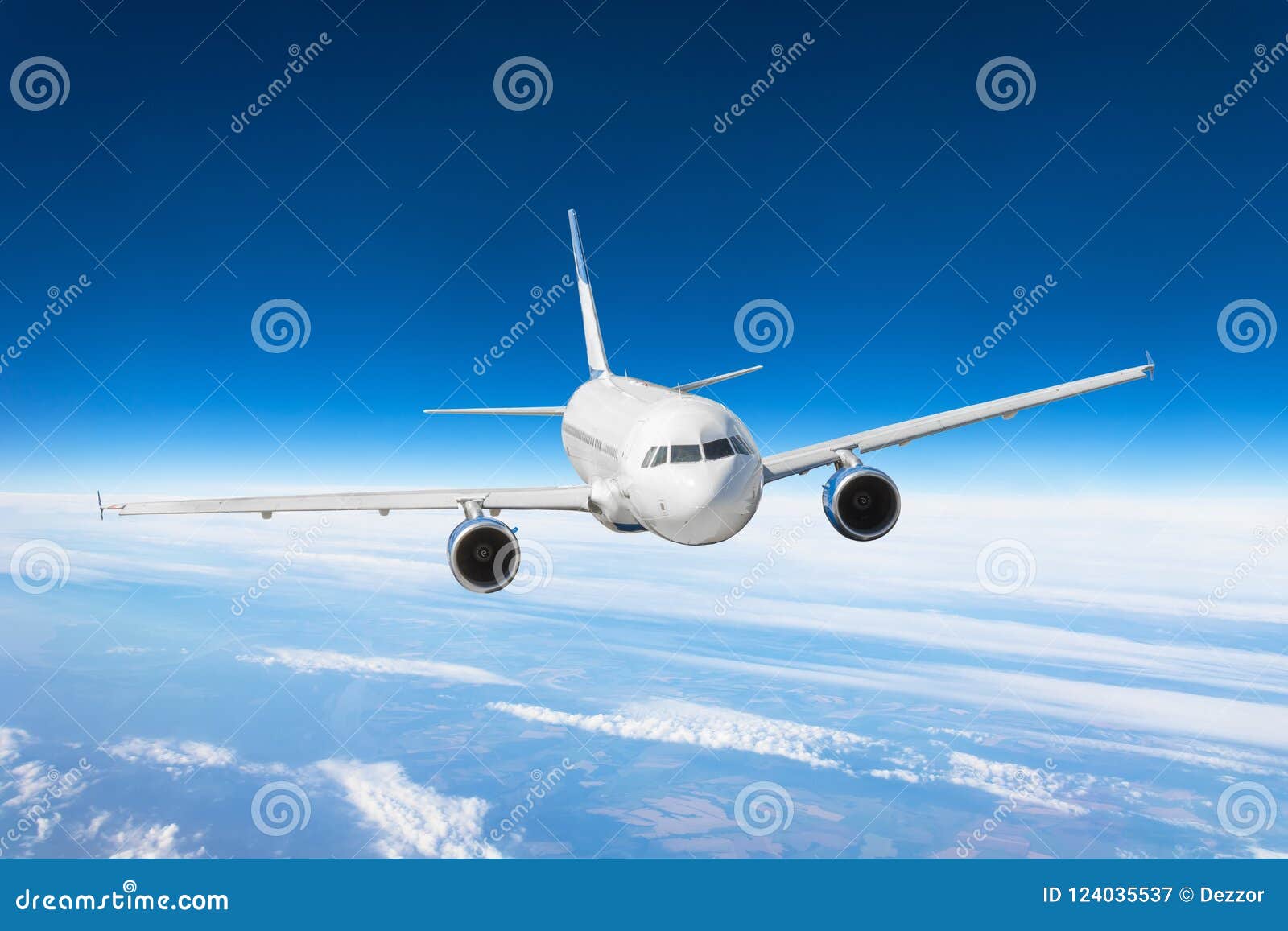 Airplane Fly Over the Clouds and the Earth`s Surface Under the Blue Sky ...