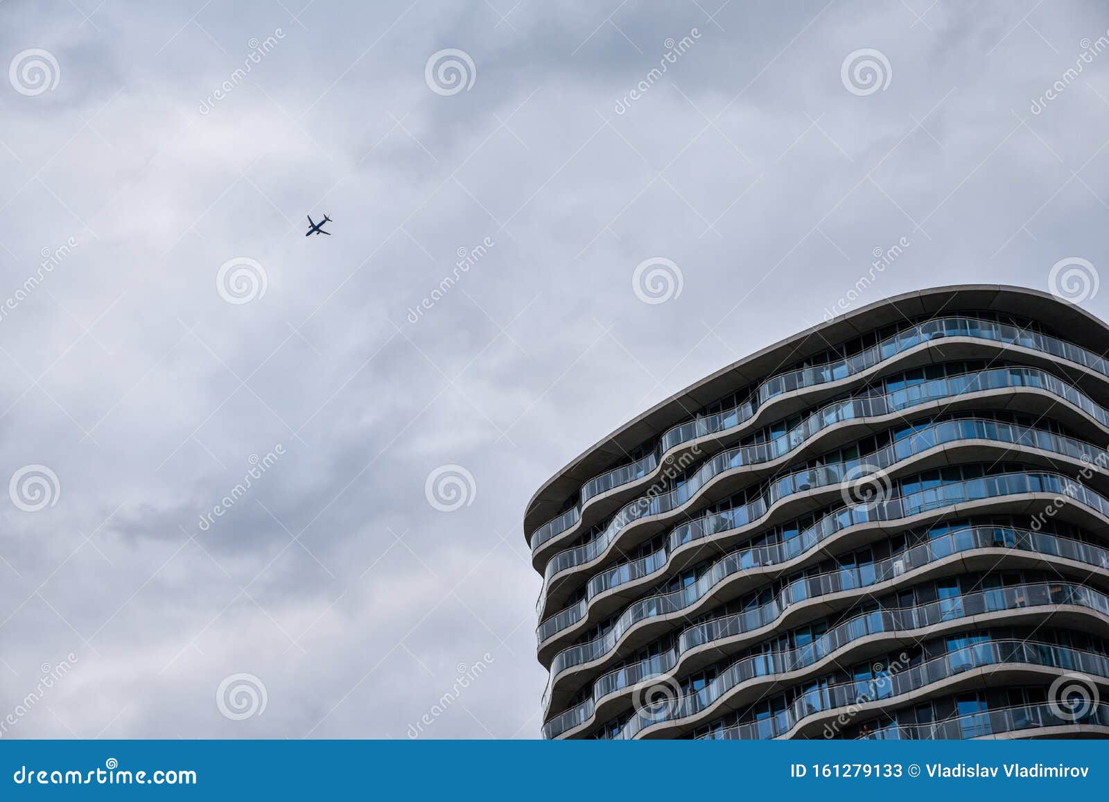 Airplane Flying Above a Large Building in London Stock Image - Image of ...
