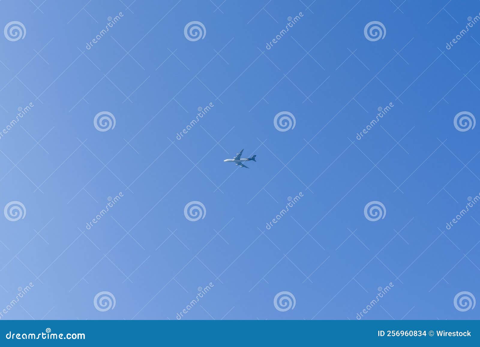 Airplane Flying in the Bright Blue Sky Stock Photo - Image of blue ...