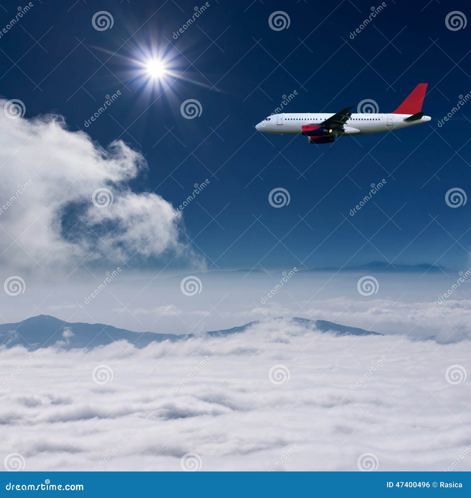 Airplane Flying at High Altitude Above the Clouds Stock Photo - Image ...
