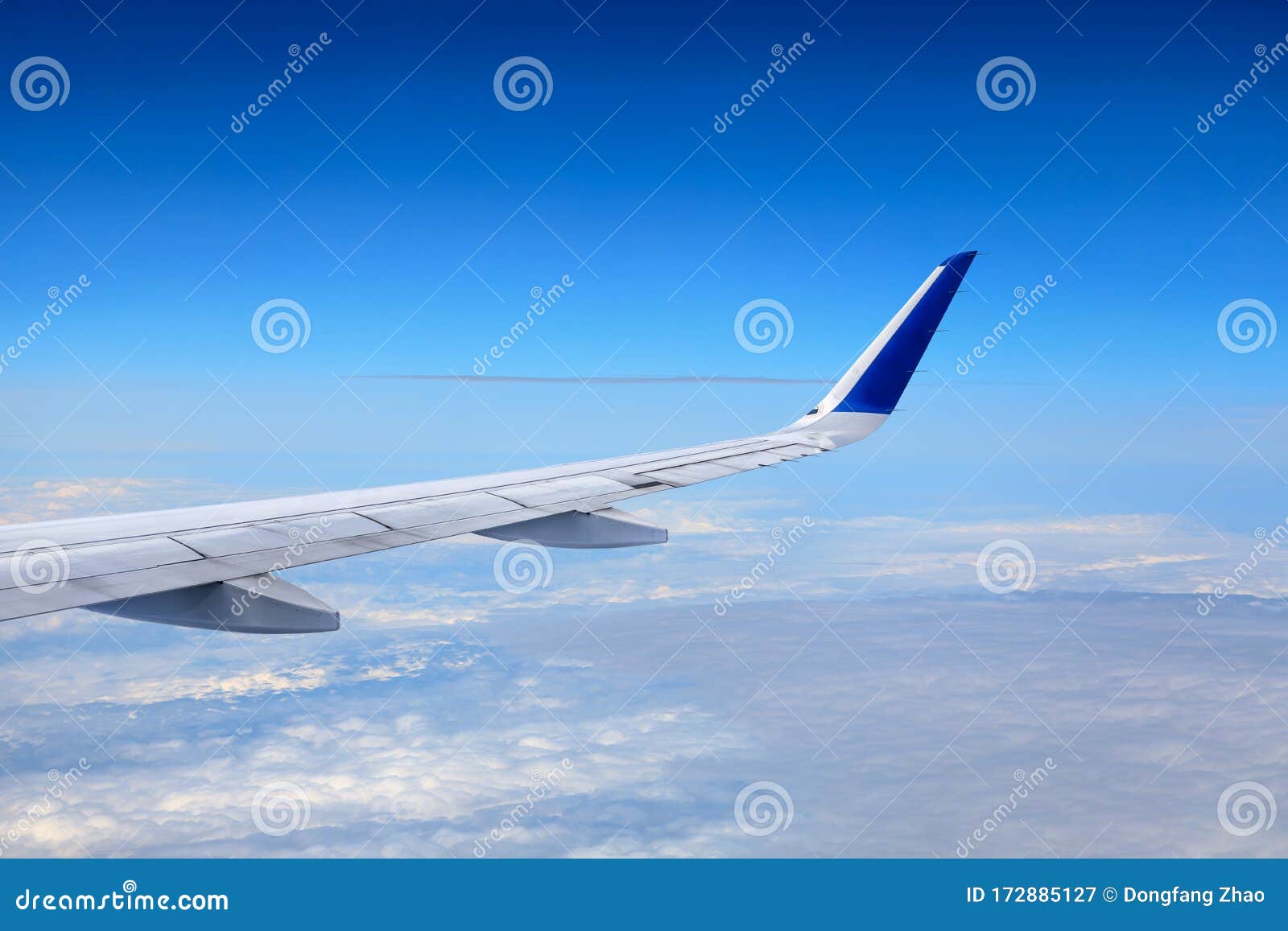 Airplane Flying at High Altitude and Beautiful High-altitude Clouds ...