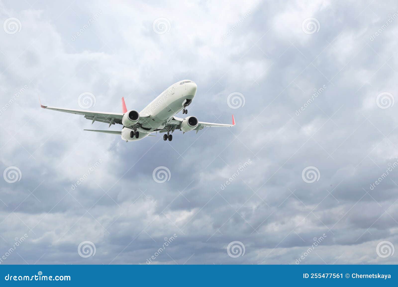 Airplane Flying High in Cloudy Sky. Modern Aircraft Stock Image - Image ...