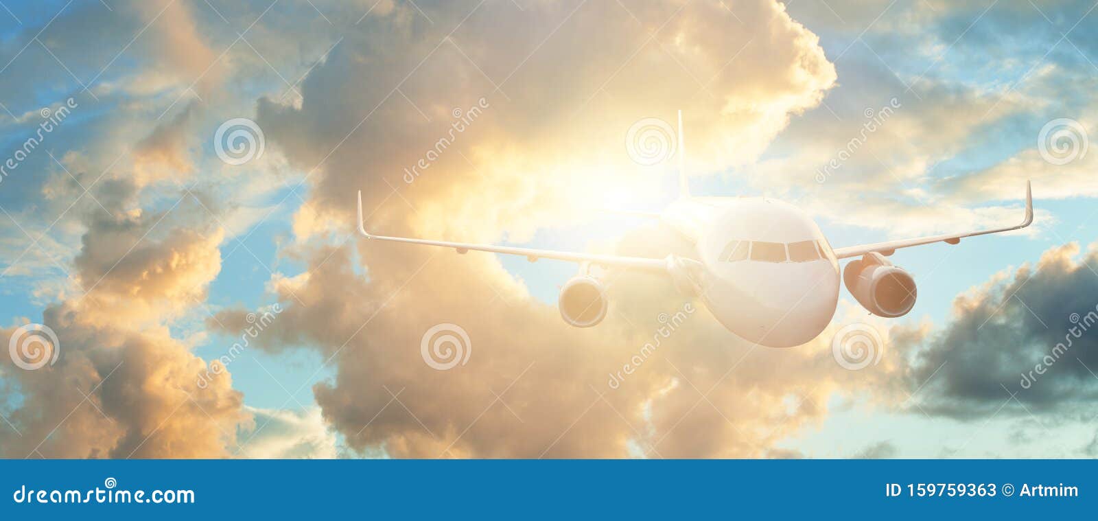 Airplane Flying Over the Clouds Front with Sunset Background Stock ...