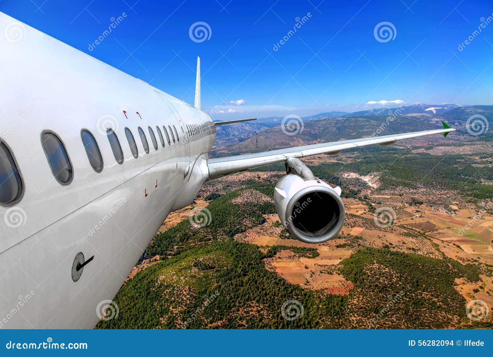 Airplane Flying Over the Ground Stock Photo - Image of airport, aerial ...