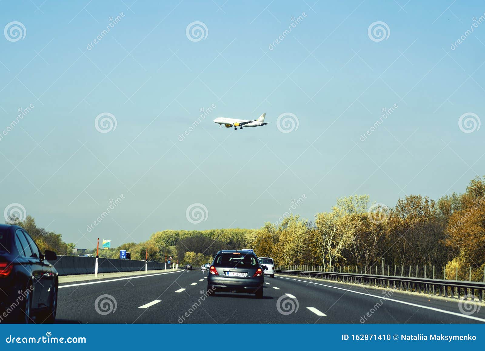 Airplane Flying Over Highway Road.The Plane Flies Over The Road ...