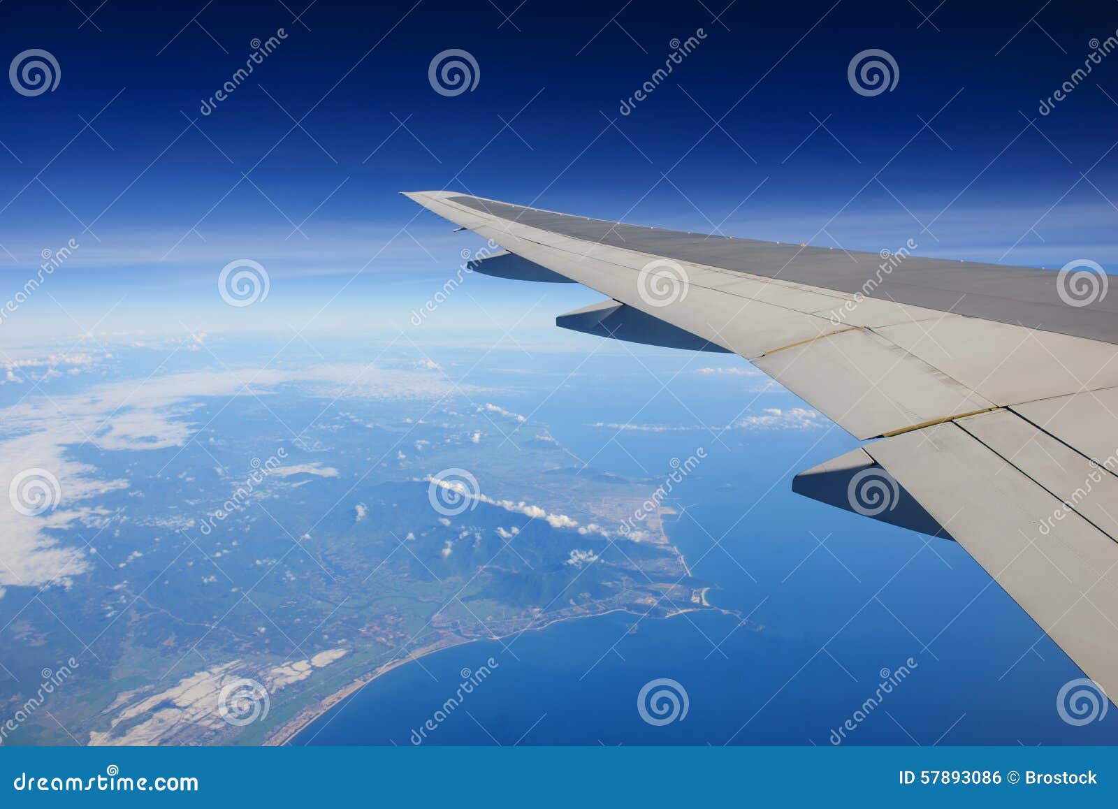 Airplane Flying Over Ocean and Island Stock Photo - Image of journey ...