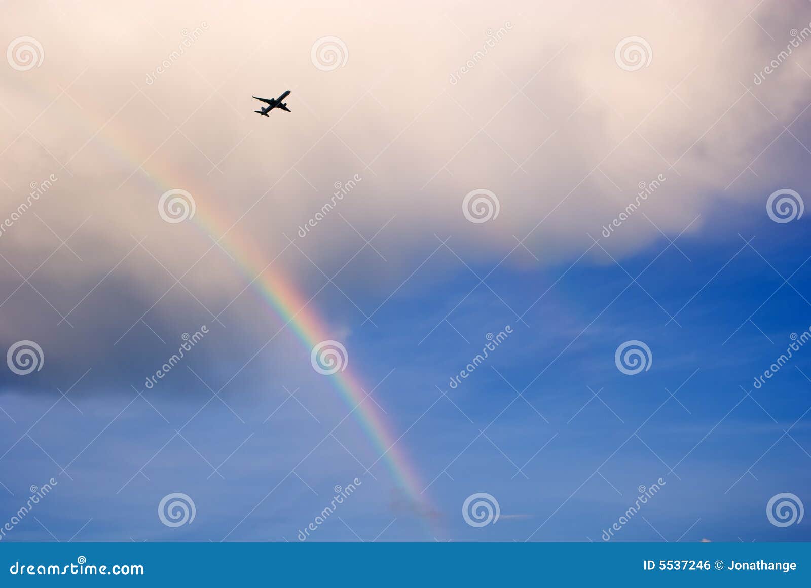 Airplane Flying Over Rainbow Stock Photo - Image of flying, cloudscape ...