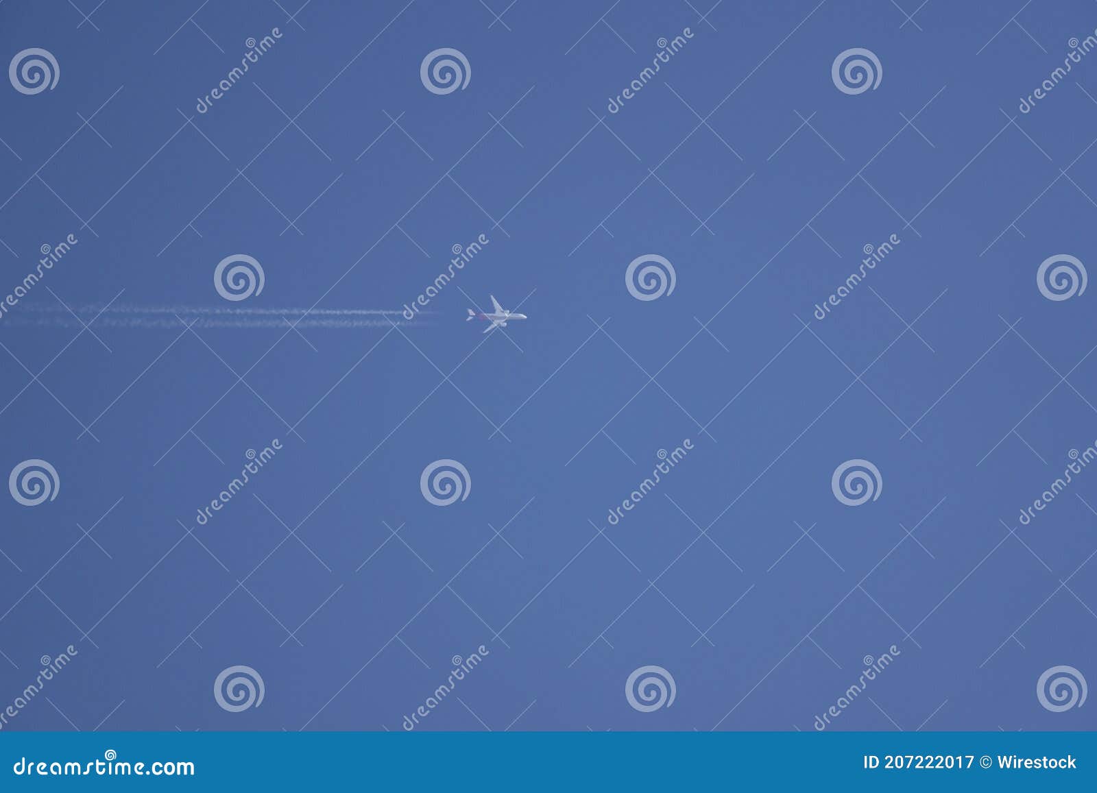 Airplane Flying in the Sky with a Long White Trace Stock Image - Image ...