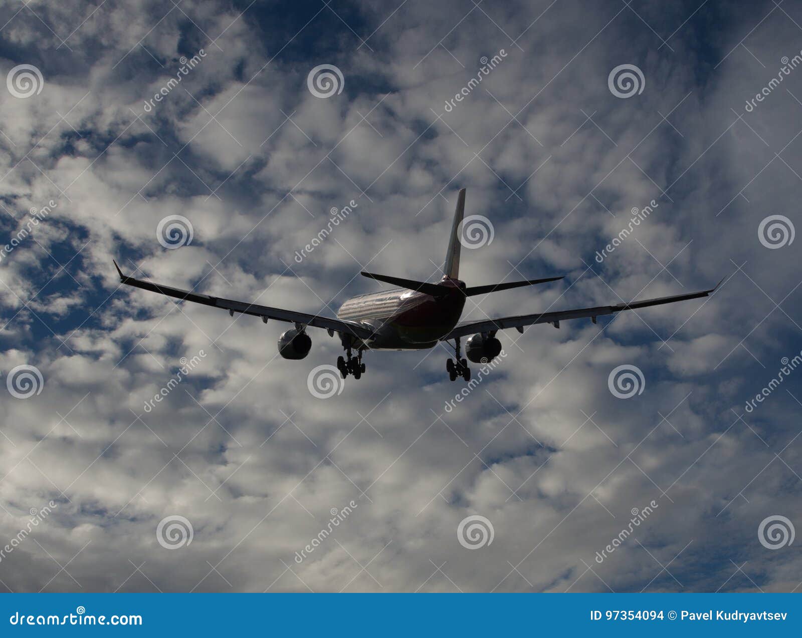 Airplane Flying in Sky with Storm Clouds at Sunset Stock Photo - Image ...