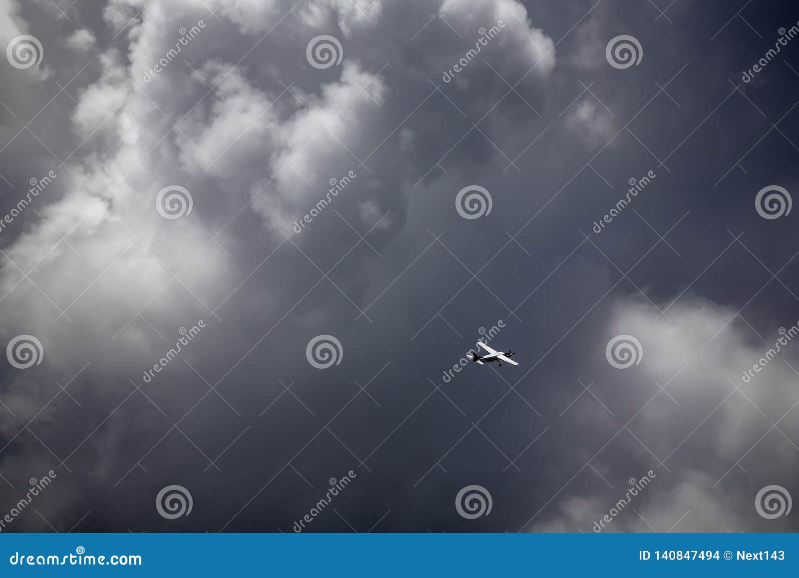 An Airplane Flying through the Storm Cloud Stock Photo - Image of ...